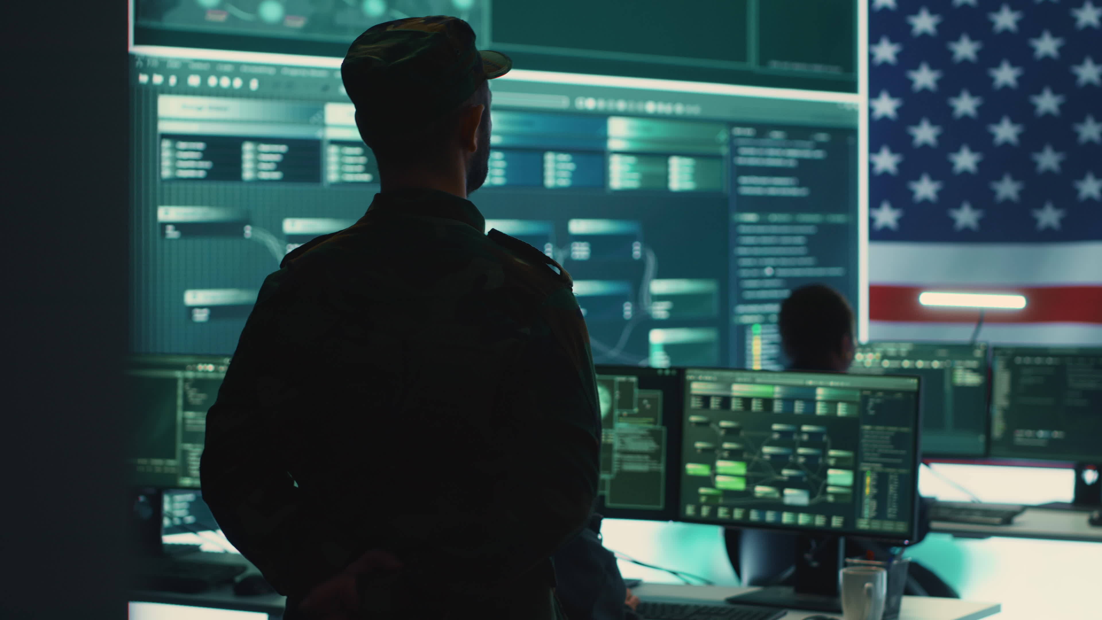 Us Military Man Supervising Threat Detection Activity In High Tech