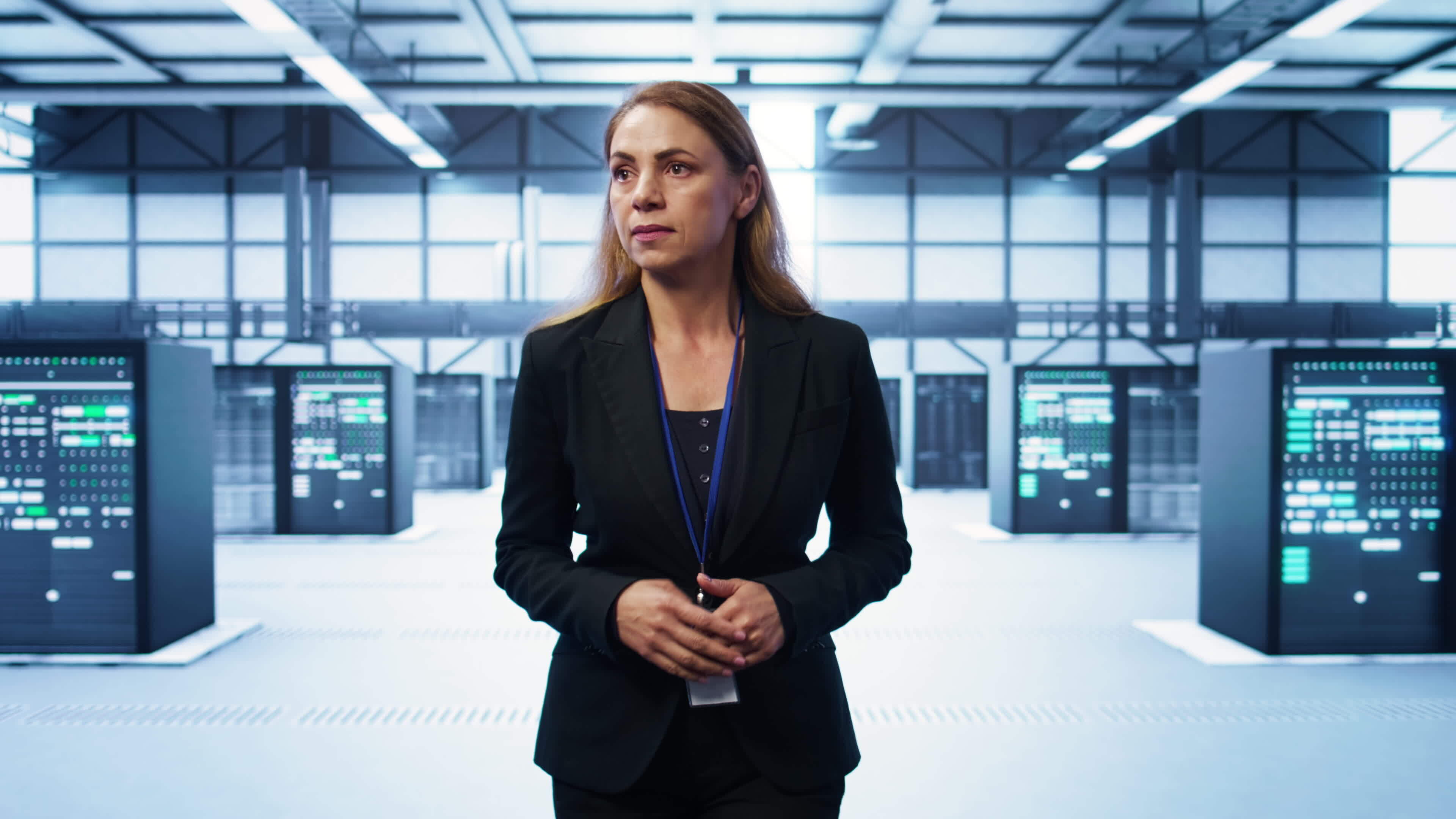 Manager Inspecting Server Room Gear Walking Between Mainframes Woman