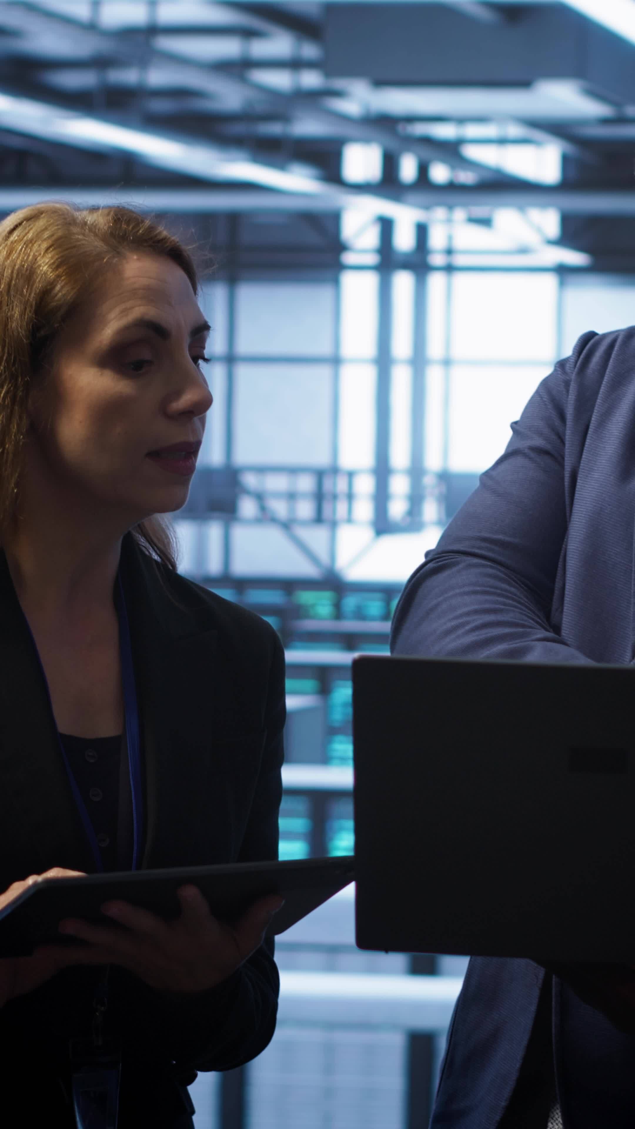 Vertical Team of IT specialists managing data center with advanced ... Vertical Team of IT specialists managing data center with advanced ...