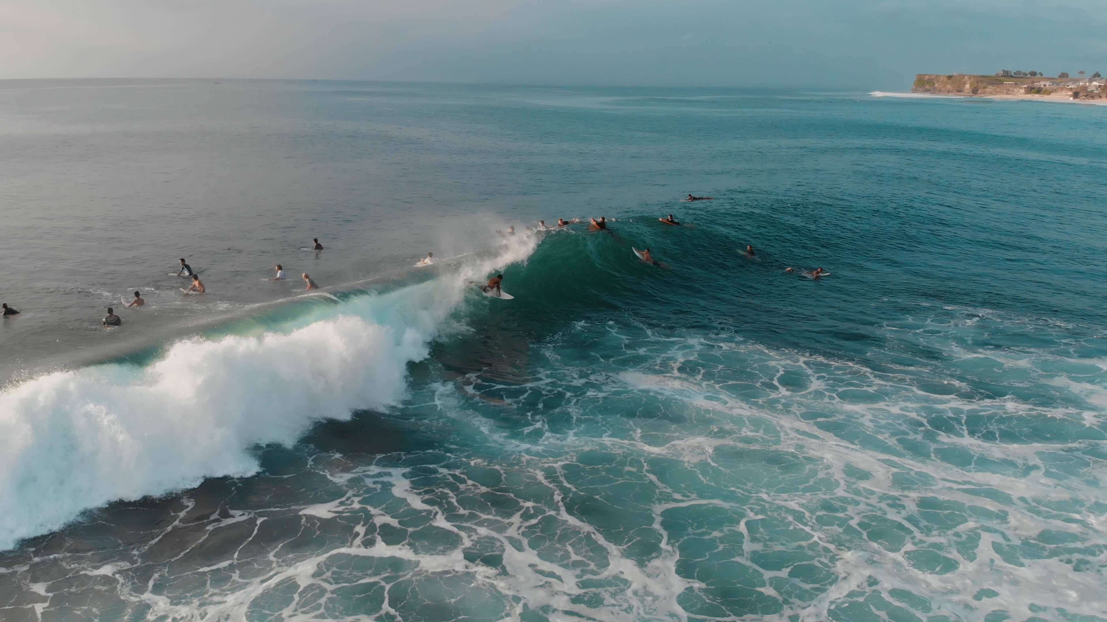 Drone view of surfing at fast barrel wave. Surfer riding on swell waves ...