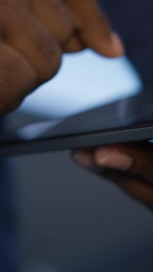 Vertical Software Developer Doing Yearly Maintenance Using Tablet To