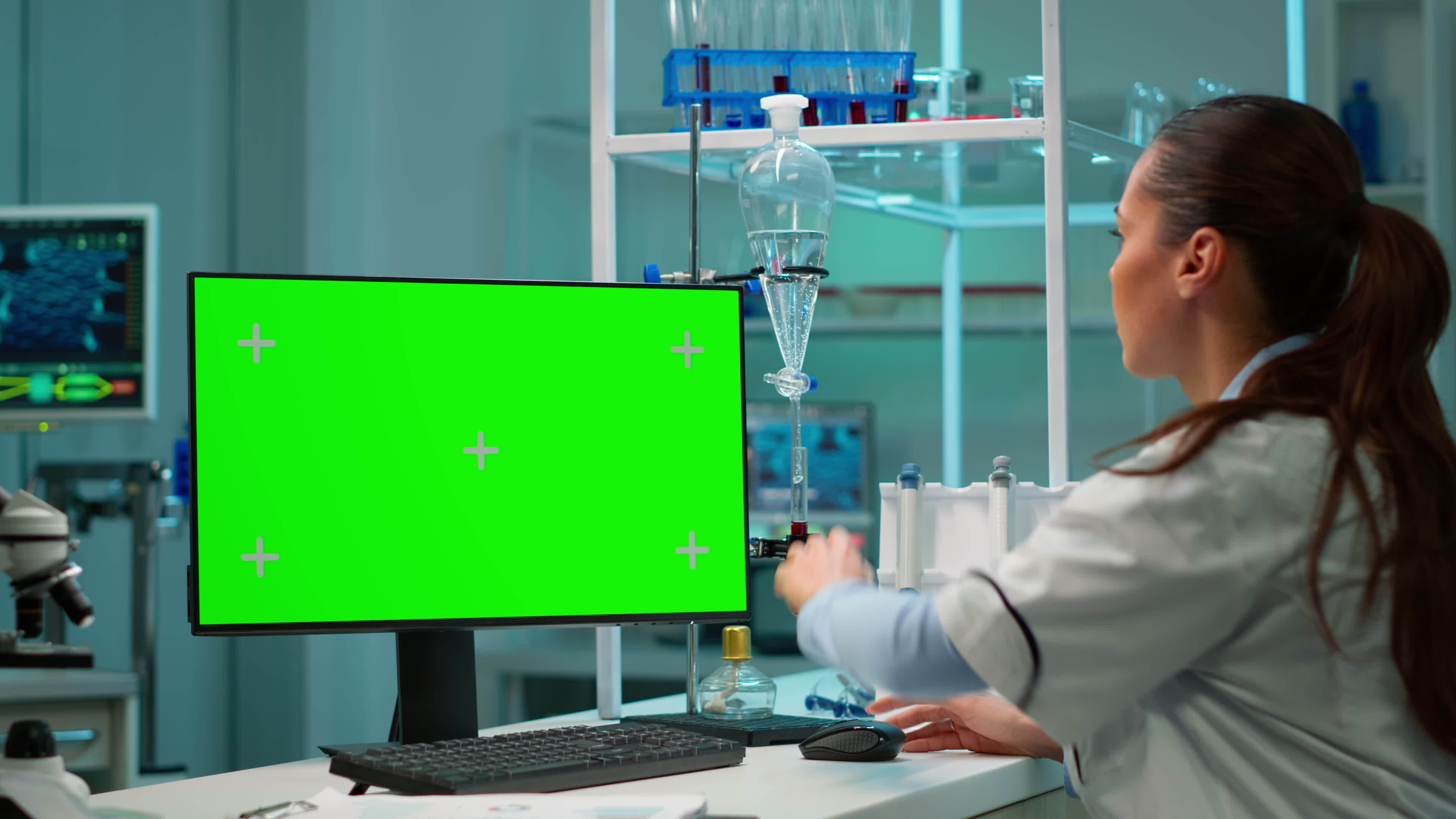 Researcher looking at chroma key display in modern equipped lab at ...