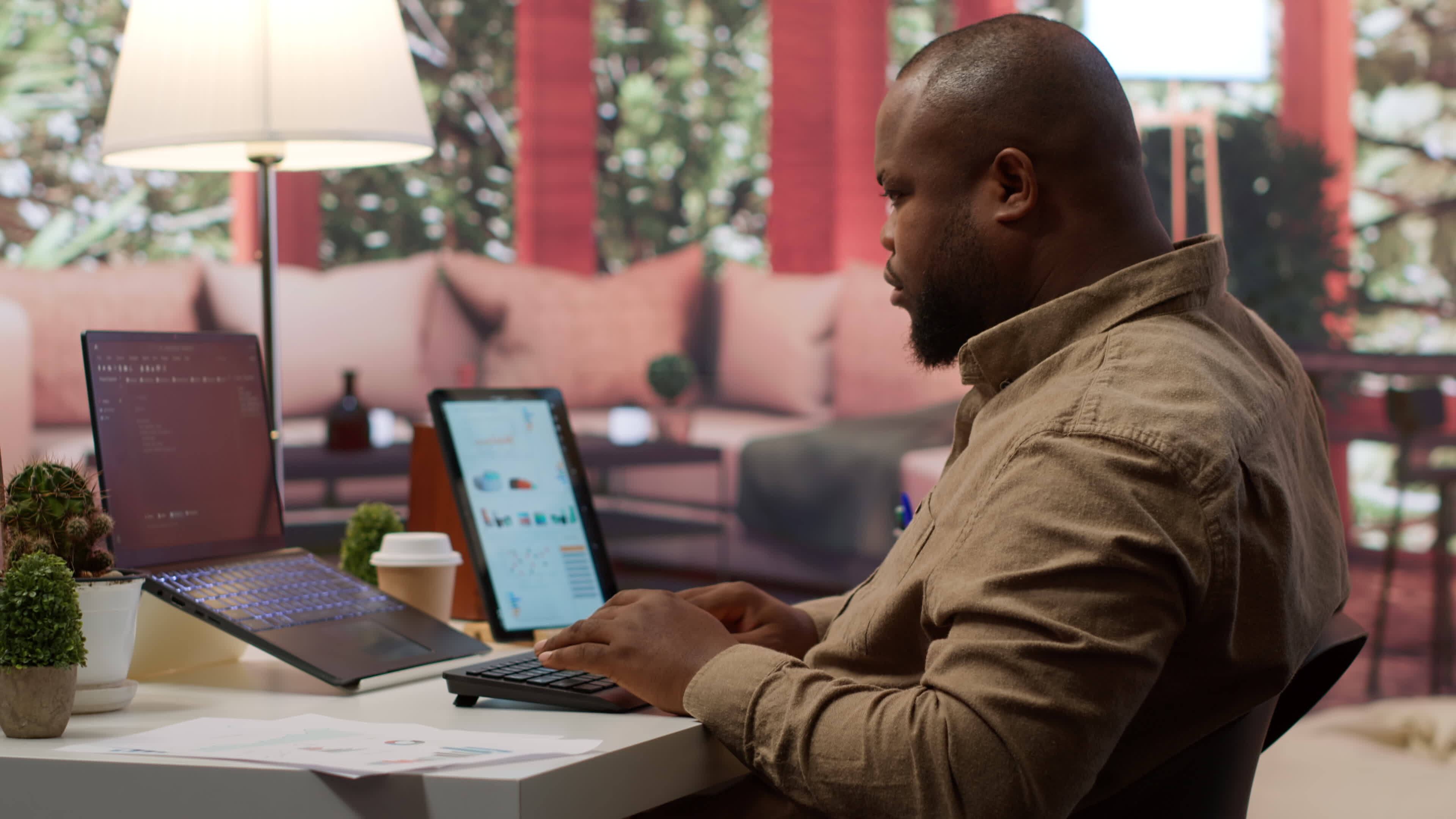 Professional IT engineer at his desk working on AI coding and deep learning projects, showcasing ...