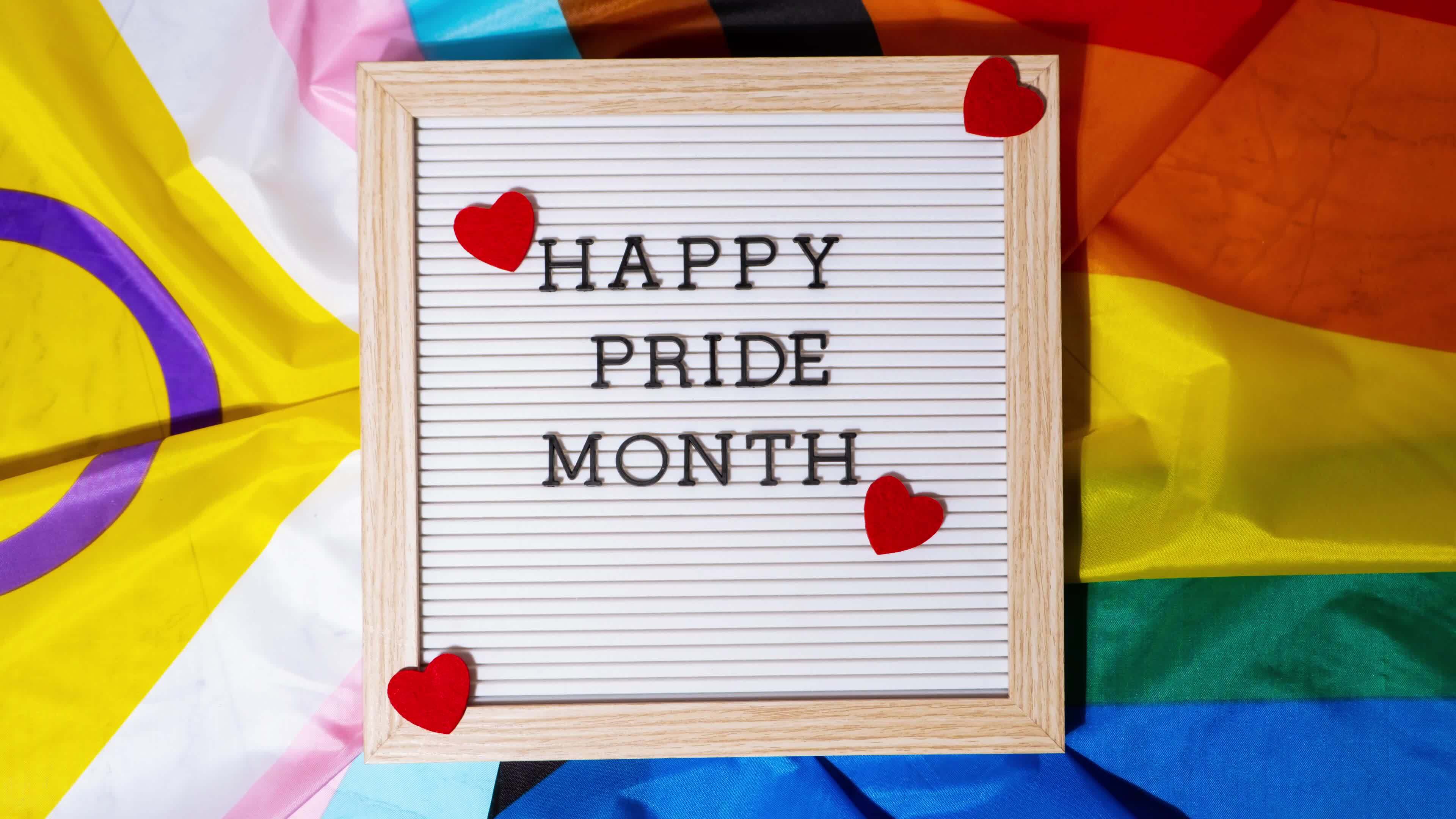 Zoom in out HAPPY PRIDE MONTH frame on Rainbow LGBTQIA flag made from ...