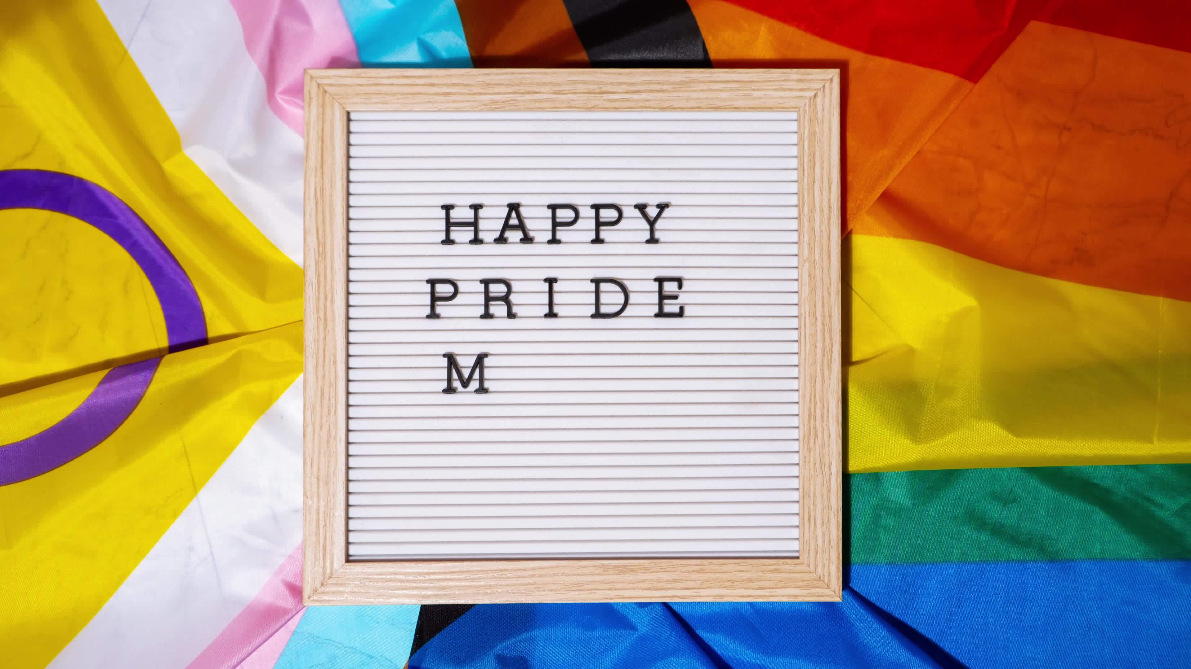 Stop motion HAPPY PRIDE MONTH frame on Rainbow LGBTQIA flag made from ...