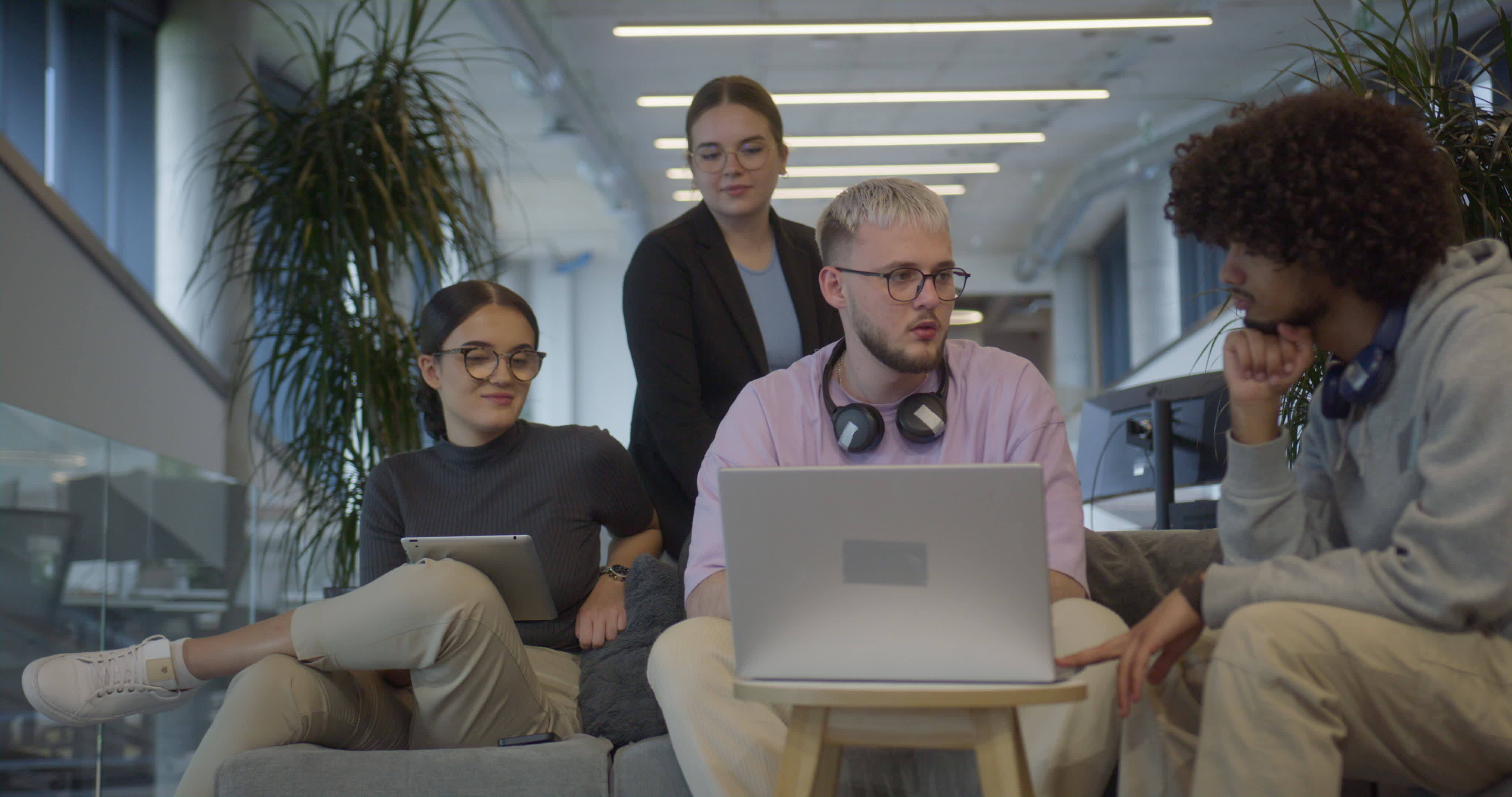 A diverse group of colleagues exchange business experiences, engage in ...