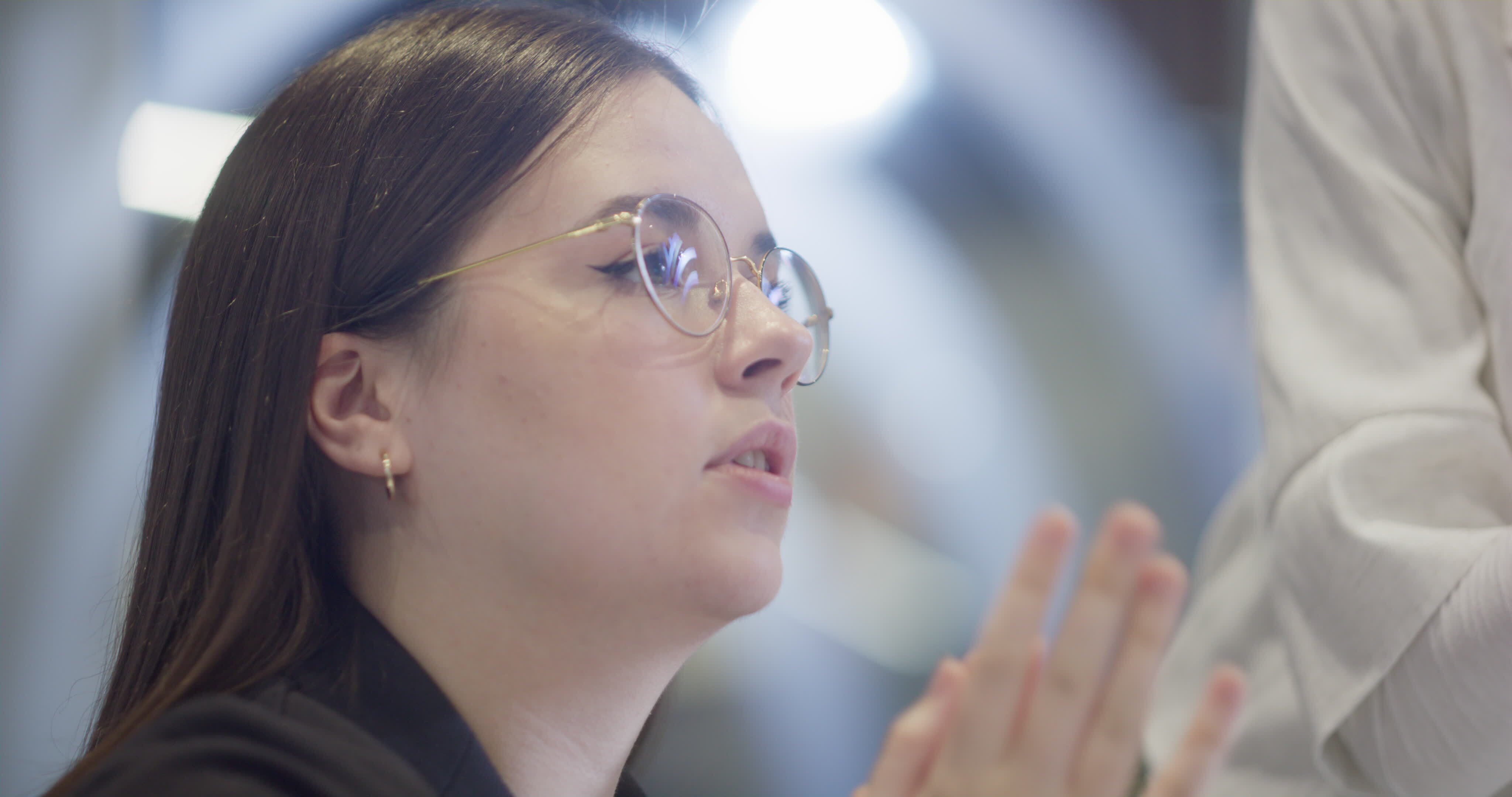 Modern businesswomens using hand gestures to explain business tasks to ... Modern businesswomens using hand gestures to explain business tasks to ...