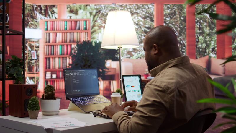 Professional IT engineer at his desk working on AI coding and deep ...