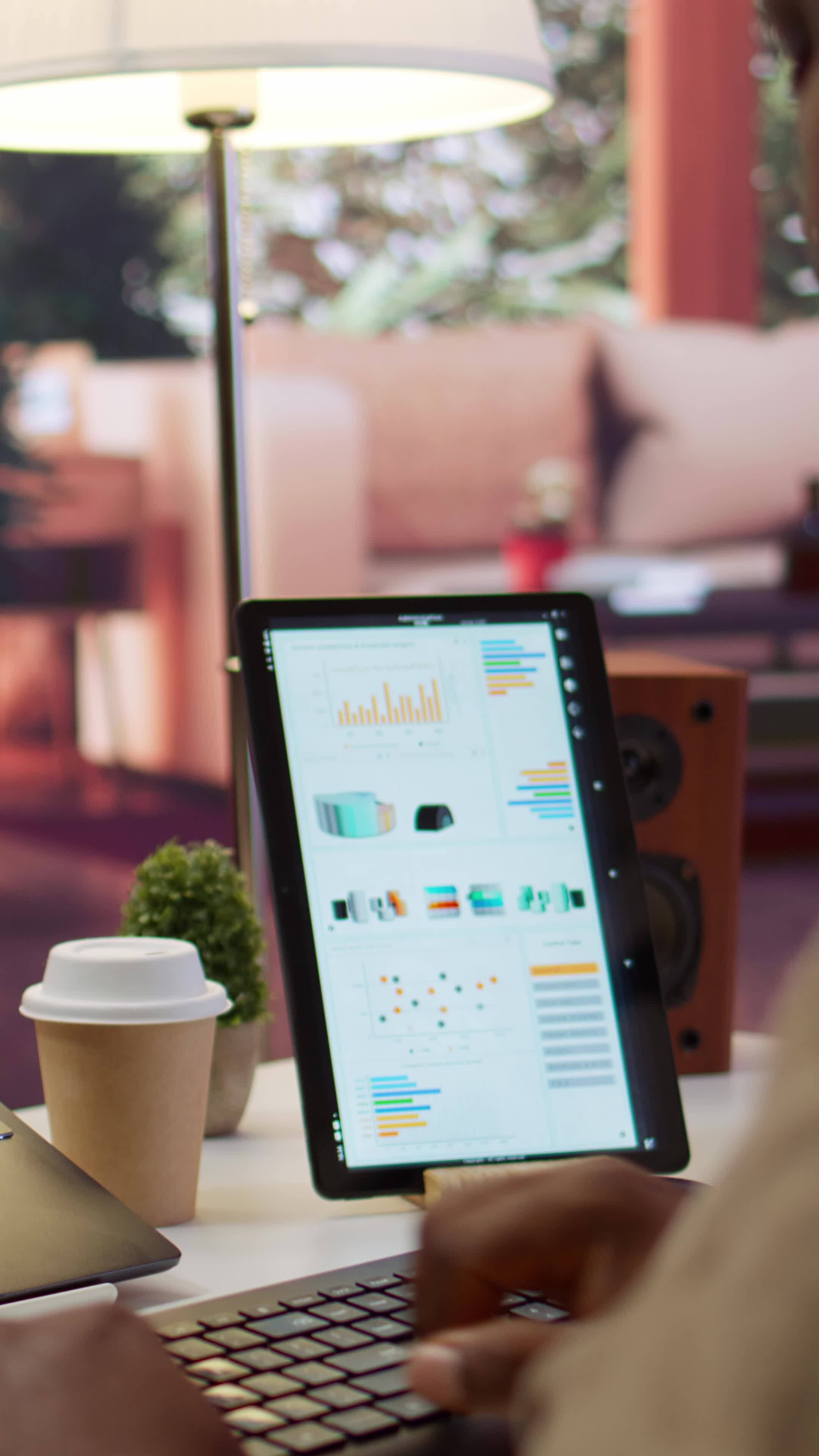 Vertical Professional software developer at desk working on AI coding ...