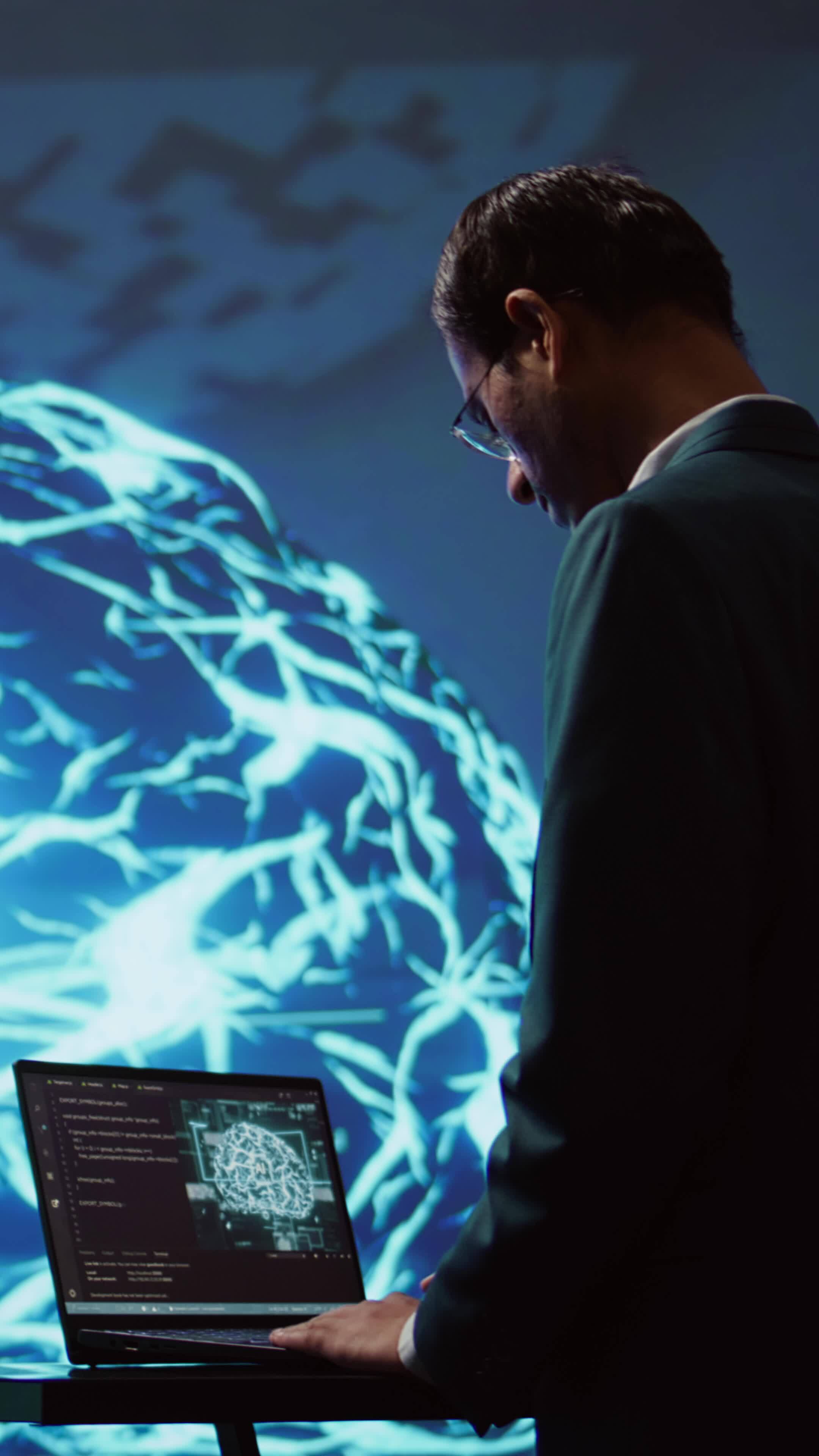 Vertical Startup employee looking over business charts, using AI ...