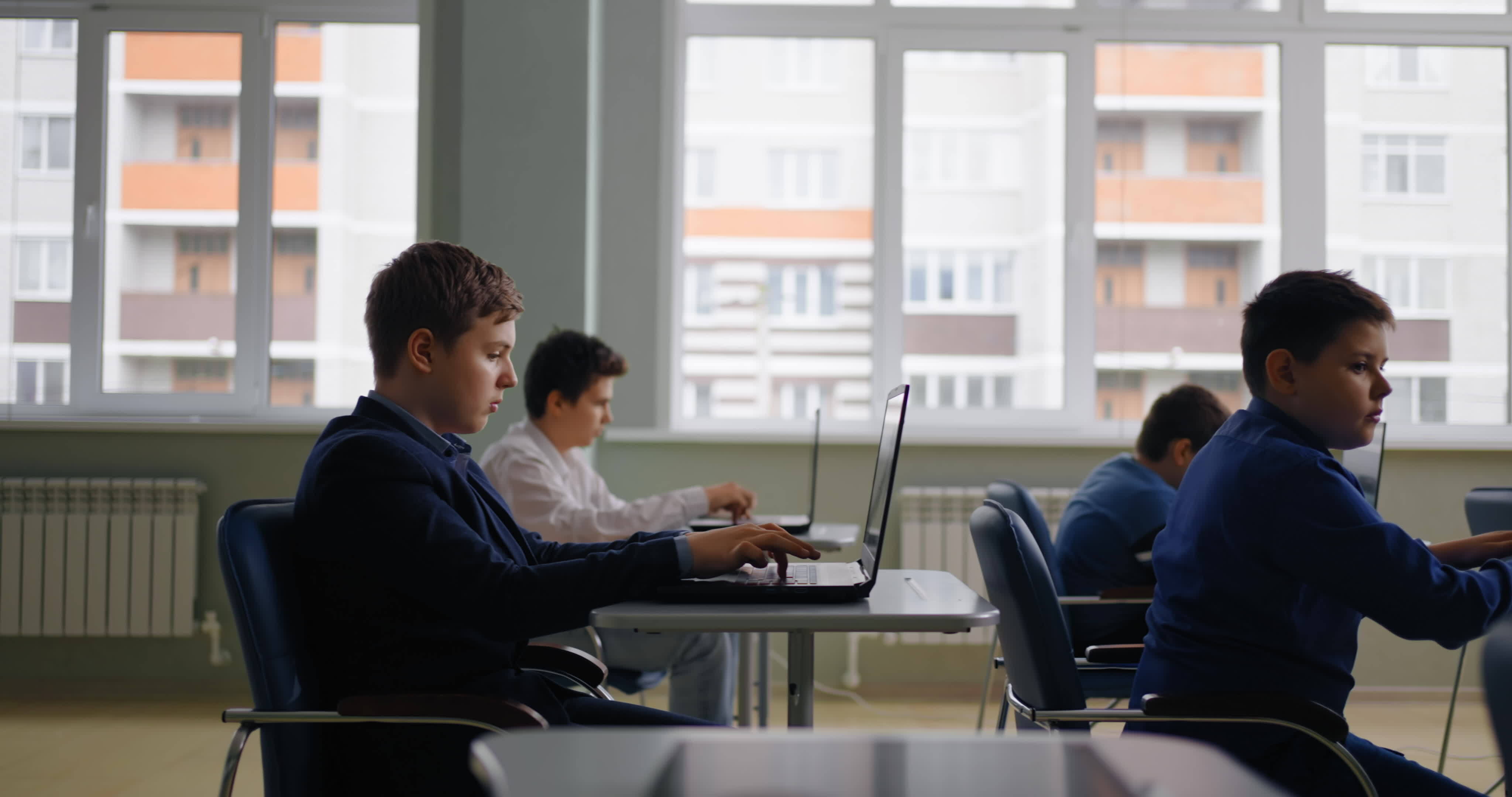 Teens Students Boys Working With Laptops In Computer-Based Classroom In ...