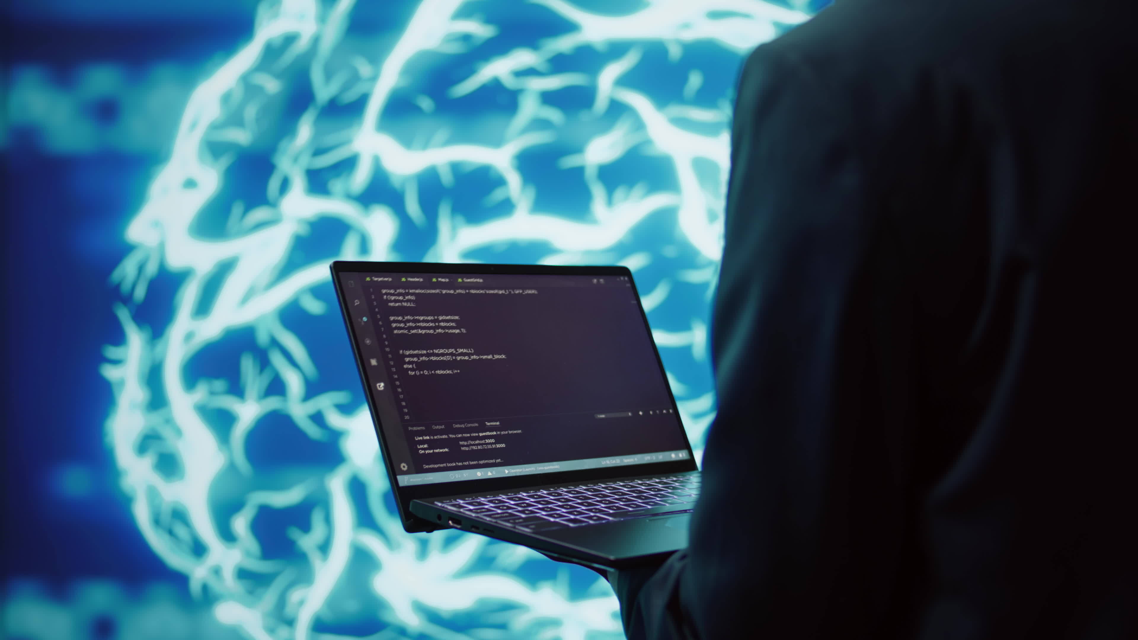 Technician uses laptop and AI neural networks modeled after human brain ... Technician uses laptop and AI neural networks modeled after human brain ...