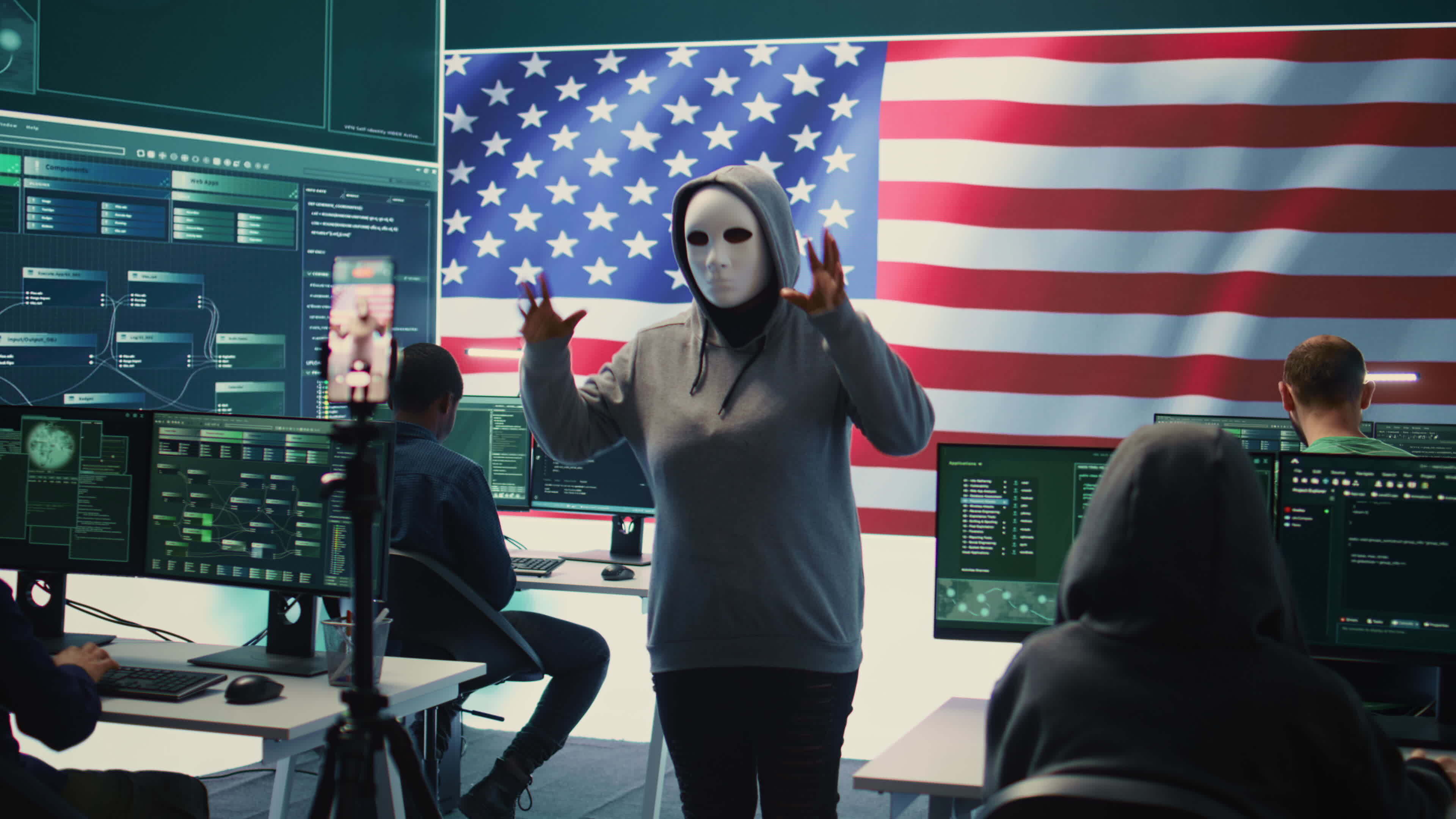 Person in anonymous mask working on intelligence in a governmental ...