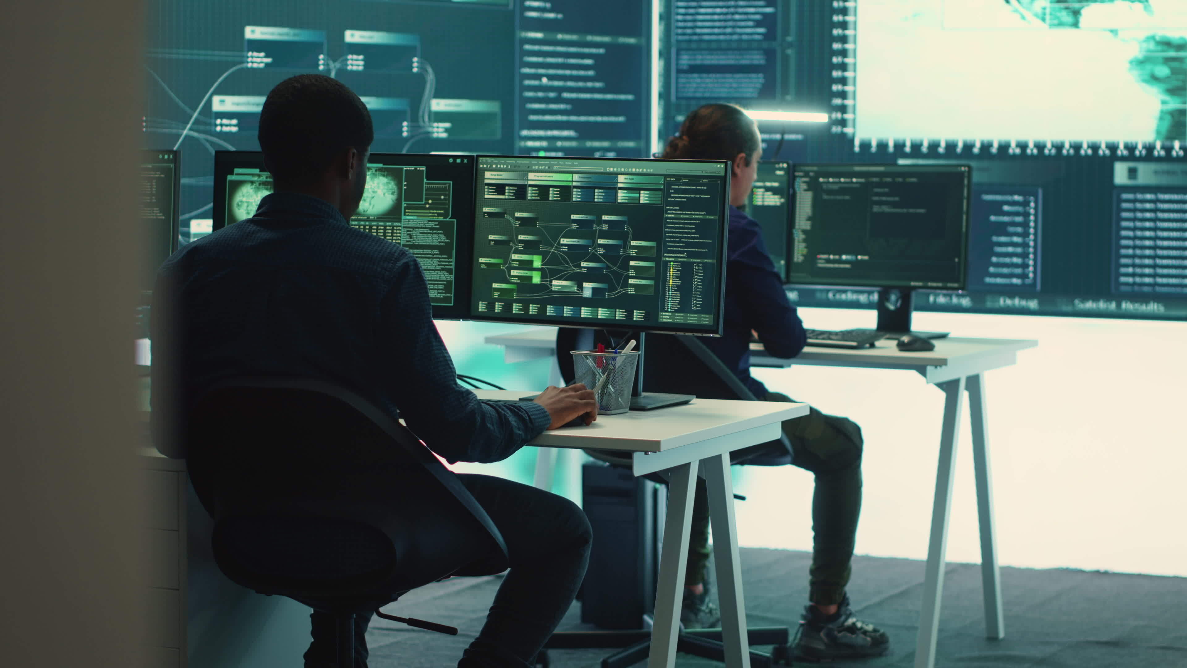 Cyber intelligence team of experts in a governmental hacking room ...