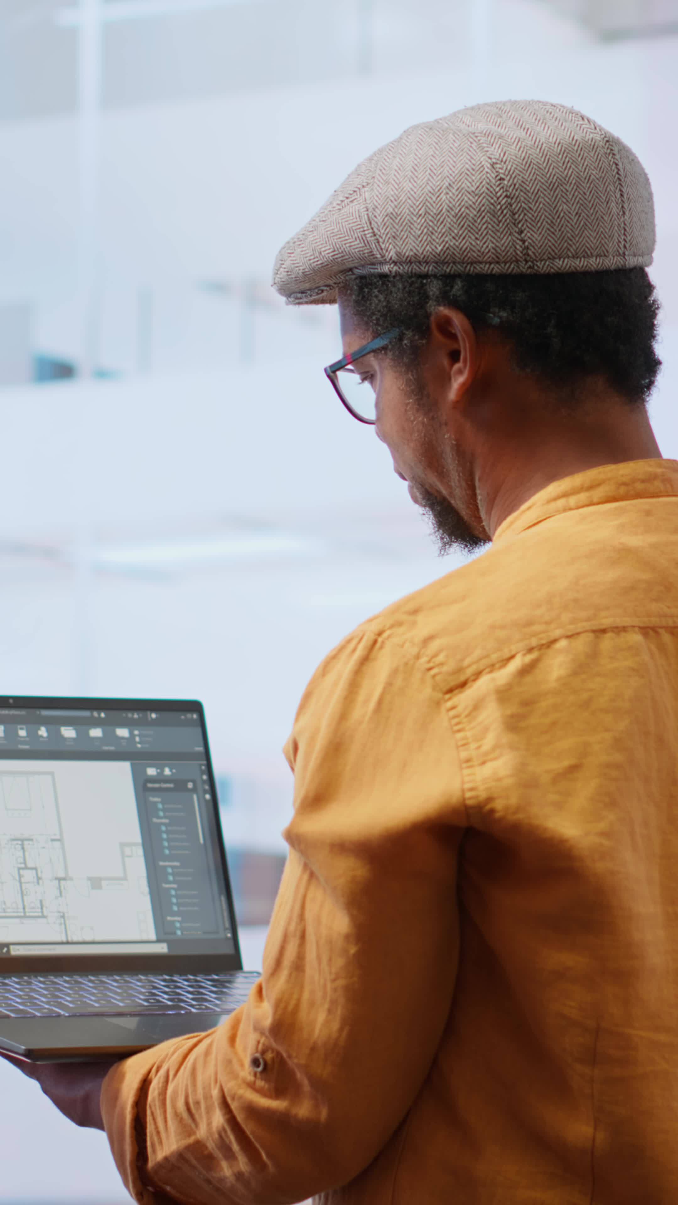 Vertical Business Team Evaluating Architectural Blueprints Layout For