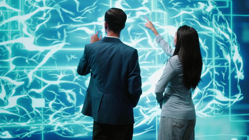 Teamworking colleagues implementing artificial intelligence parallel processing, breaking up ...