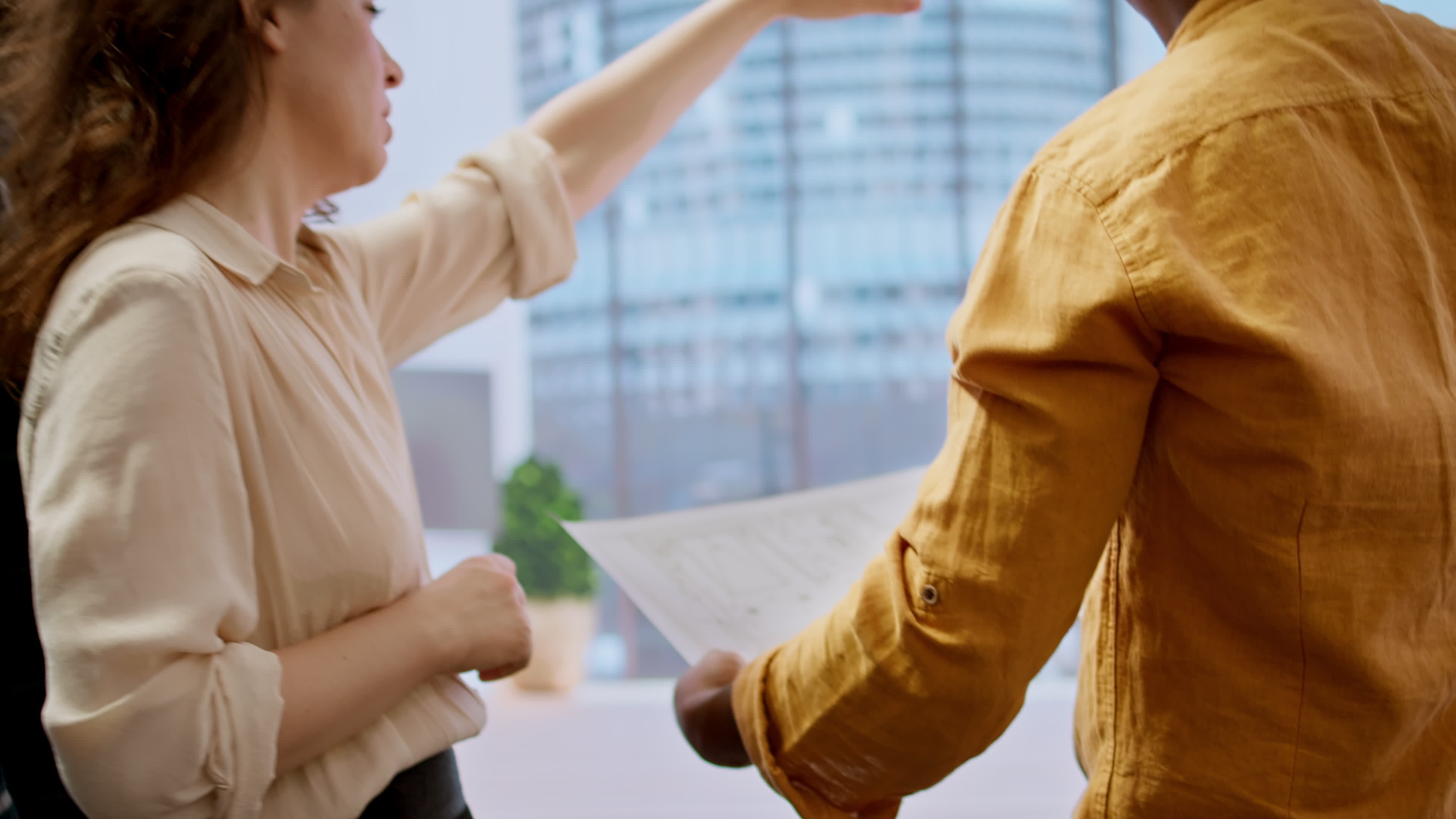 Realtor And Clients Sharing Workspace Design Vision On Office Tour