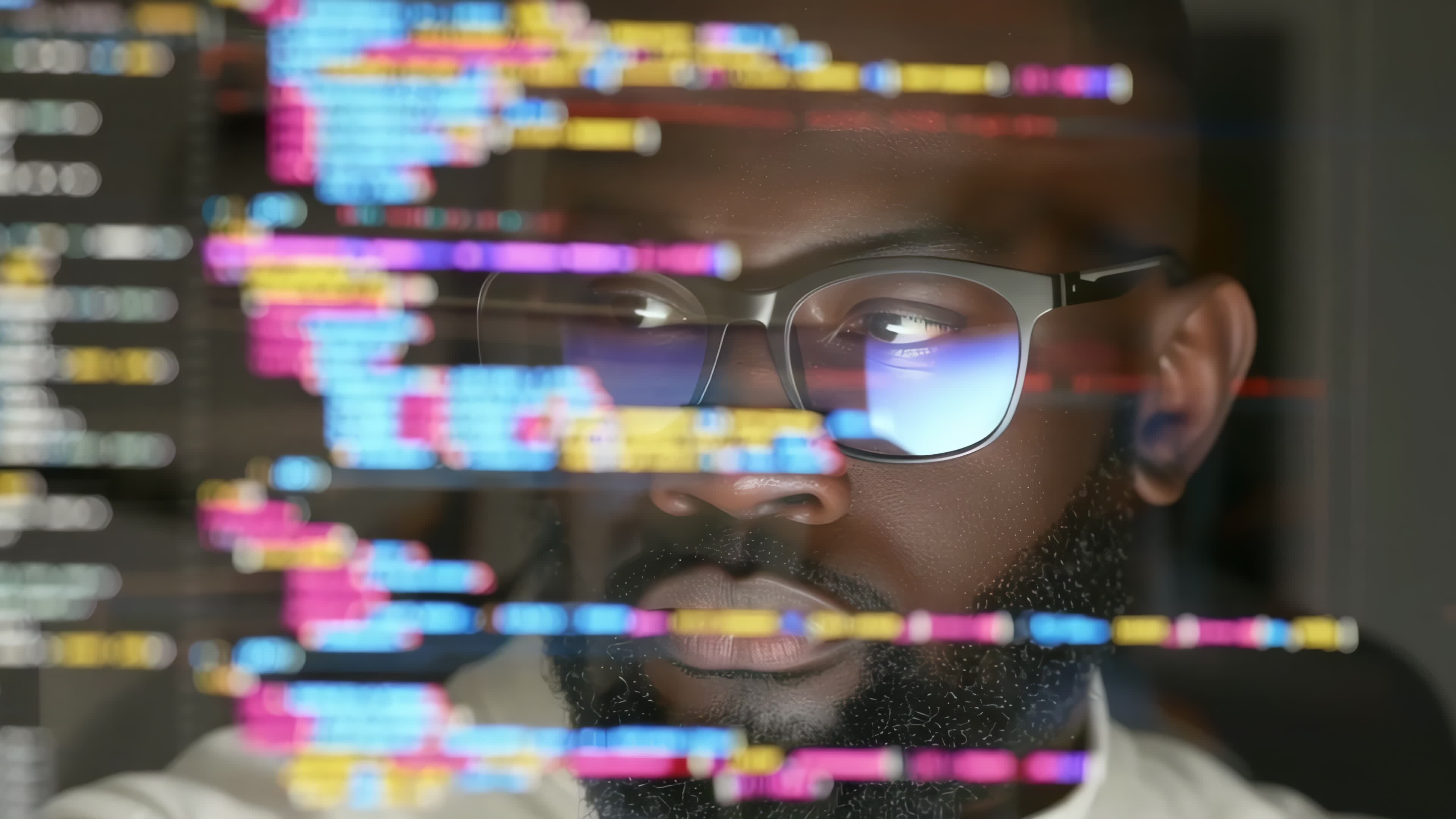 Focused programmer analyzing source code on screen, reflecting in glasses, representing coding ...