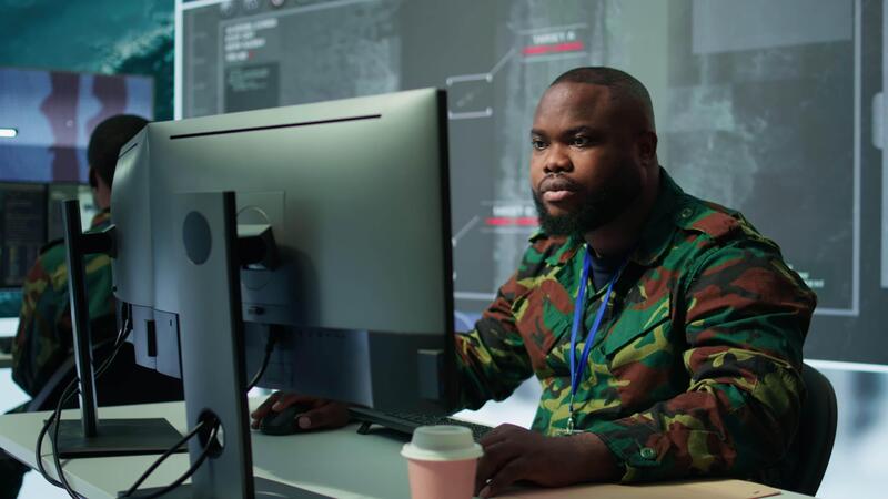 Army Professionals In Command Post Overseeing Satellite Data And Real Time Surveillance Mission