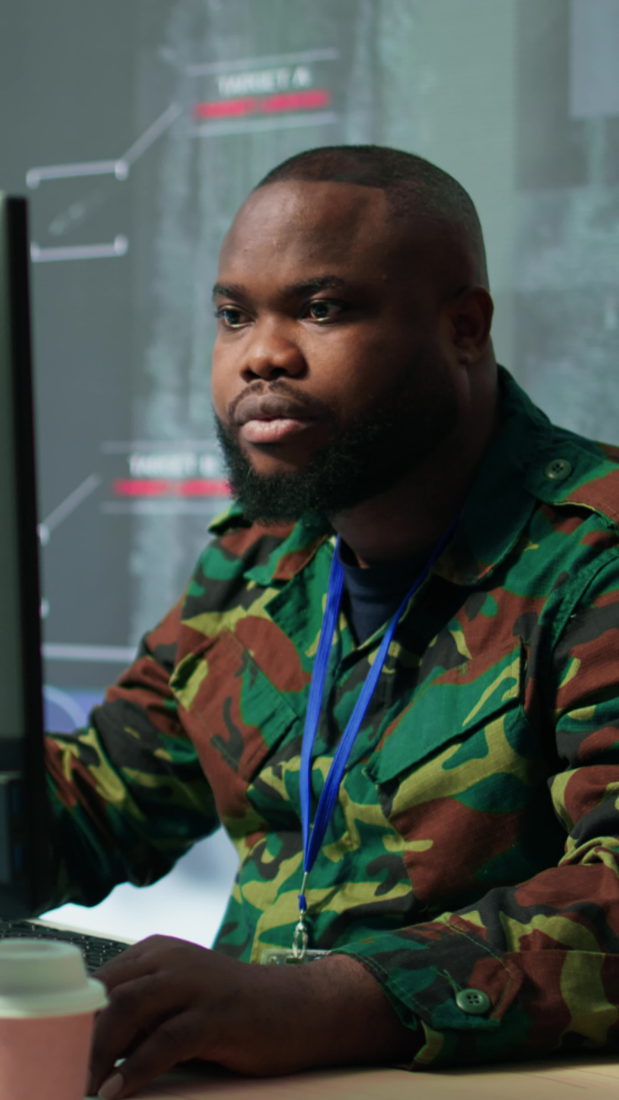 Vertical Army Professionals In Command Post Overseeing Satellite Data And Real Time Surveillance