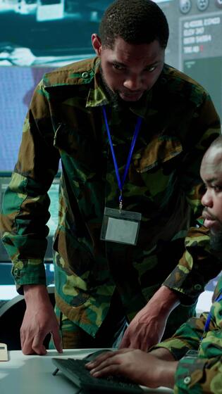 Vertical Military Staff In A Modern Operations Hub Handling Critical Information Collected On