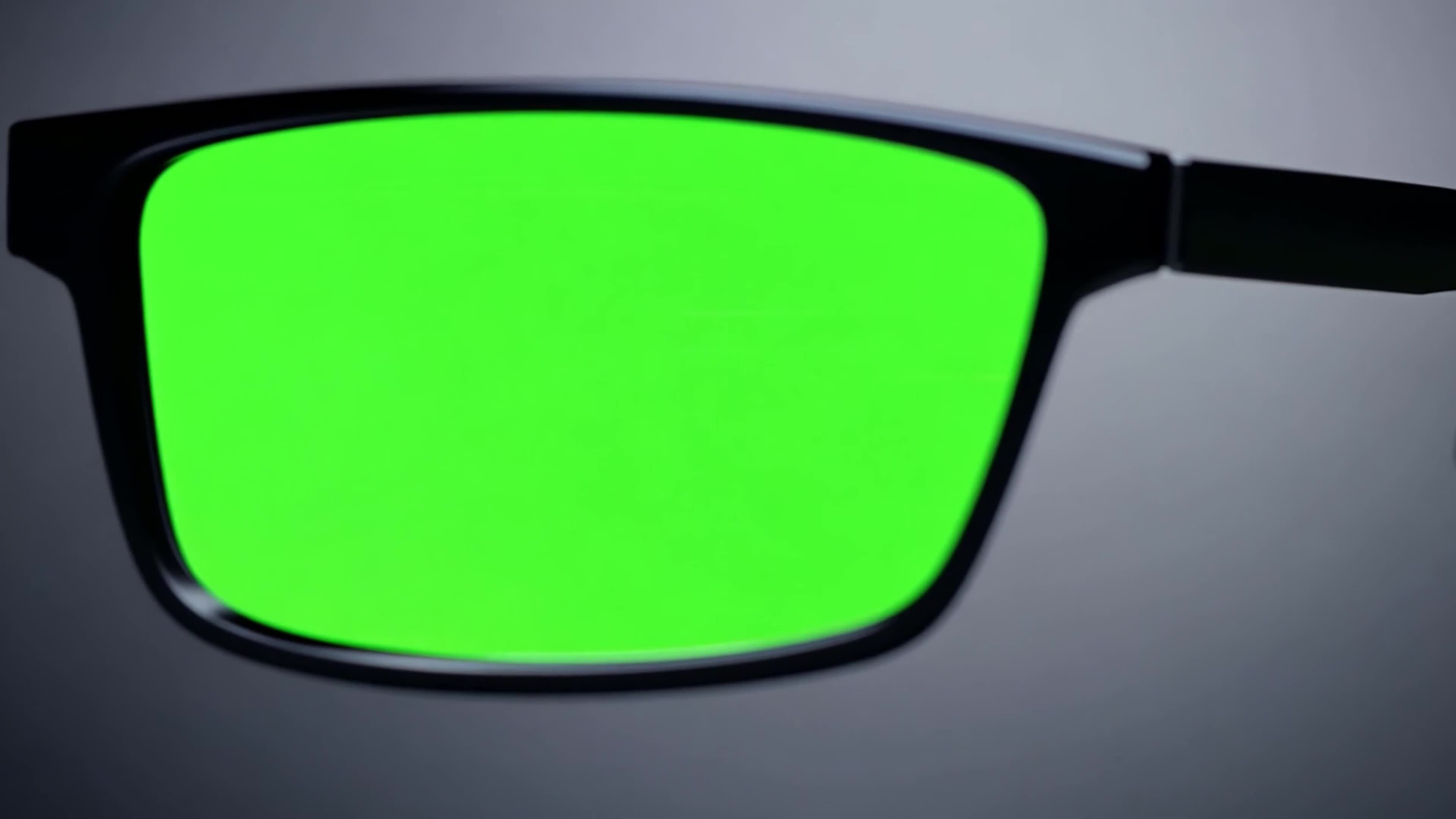 Green screen reflected in computer glasses. Replace green screen with code interface. 48096526 ...