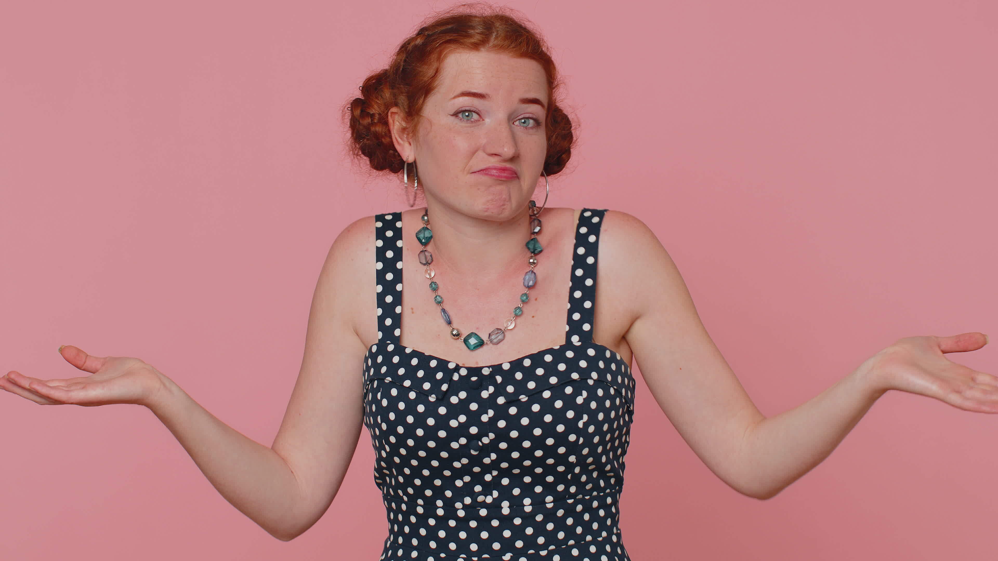 Confused redhead woman feeling embarrassed about ambiguous question ...