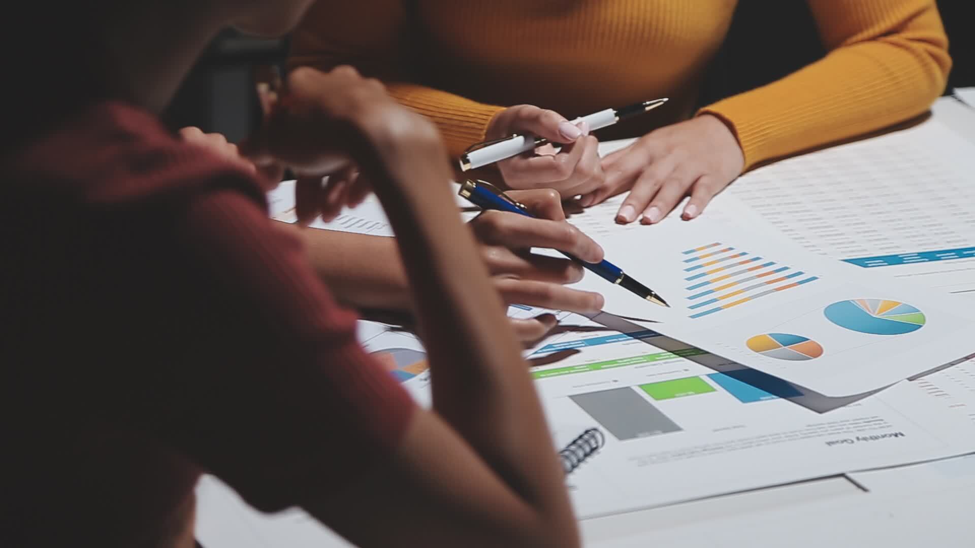 Team of business people working together in the meeting room office, teamwork background charts ...
