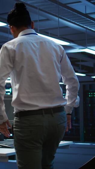 Vertical Engineer In Data Center Installing Software On Computer