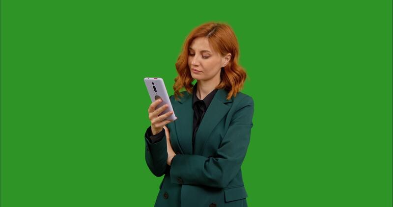 Portrait of thinking woman while scrolling on green screen background ... Portrait of thinking woman while scrolling on green screen background ...