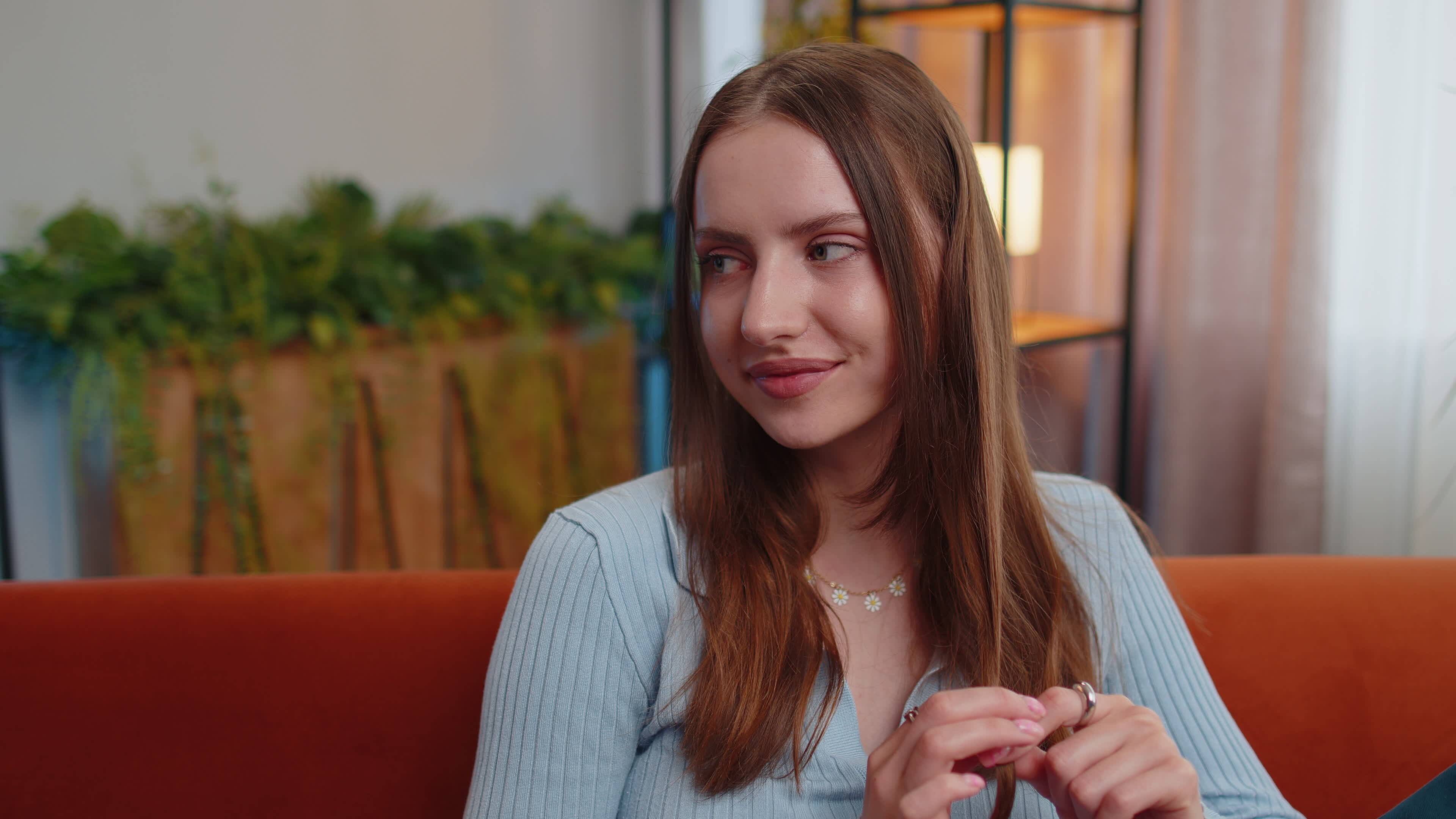 Happy calm young woman smiling looking away dreaming resting, good news, falling in love at home ...