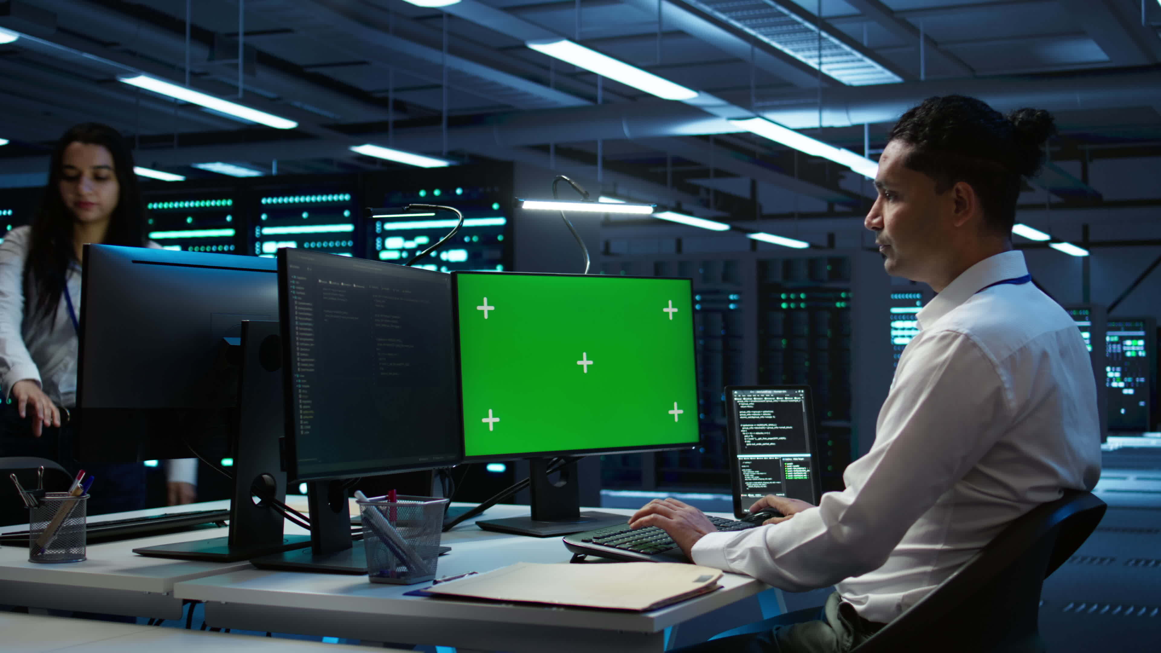 Engineer In Data Center Monitoring Security Threats Using Mockup Computer Implementing