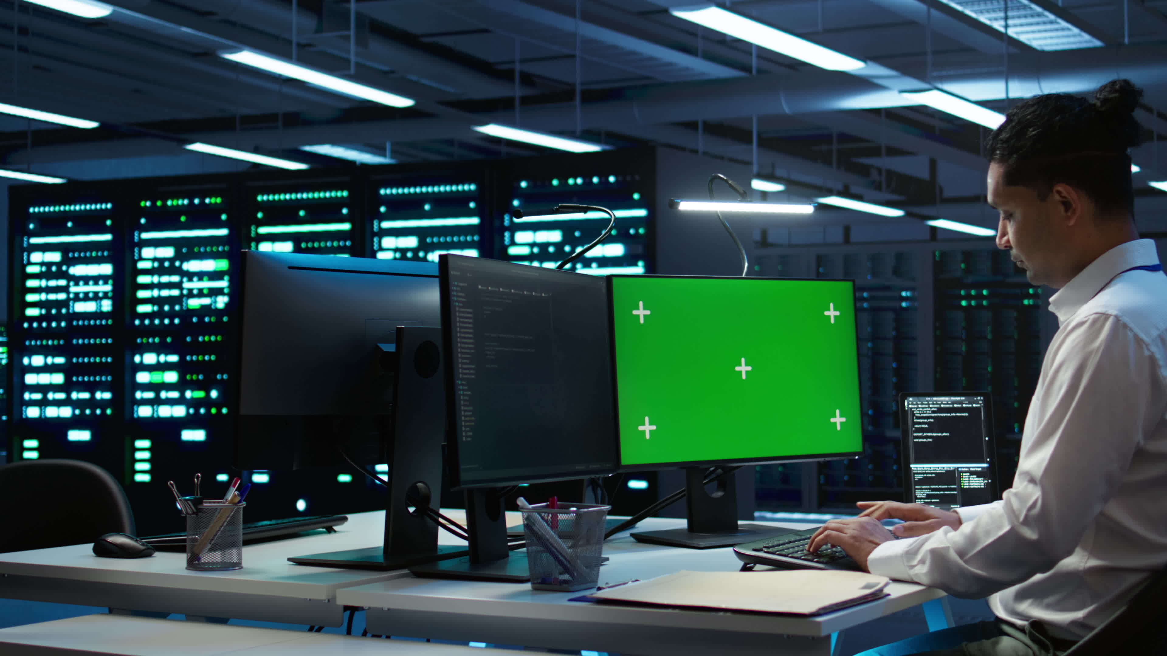 Programmer Overseeing Data Center Using Isolated Screen Computer Ensuring System Can Handle