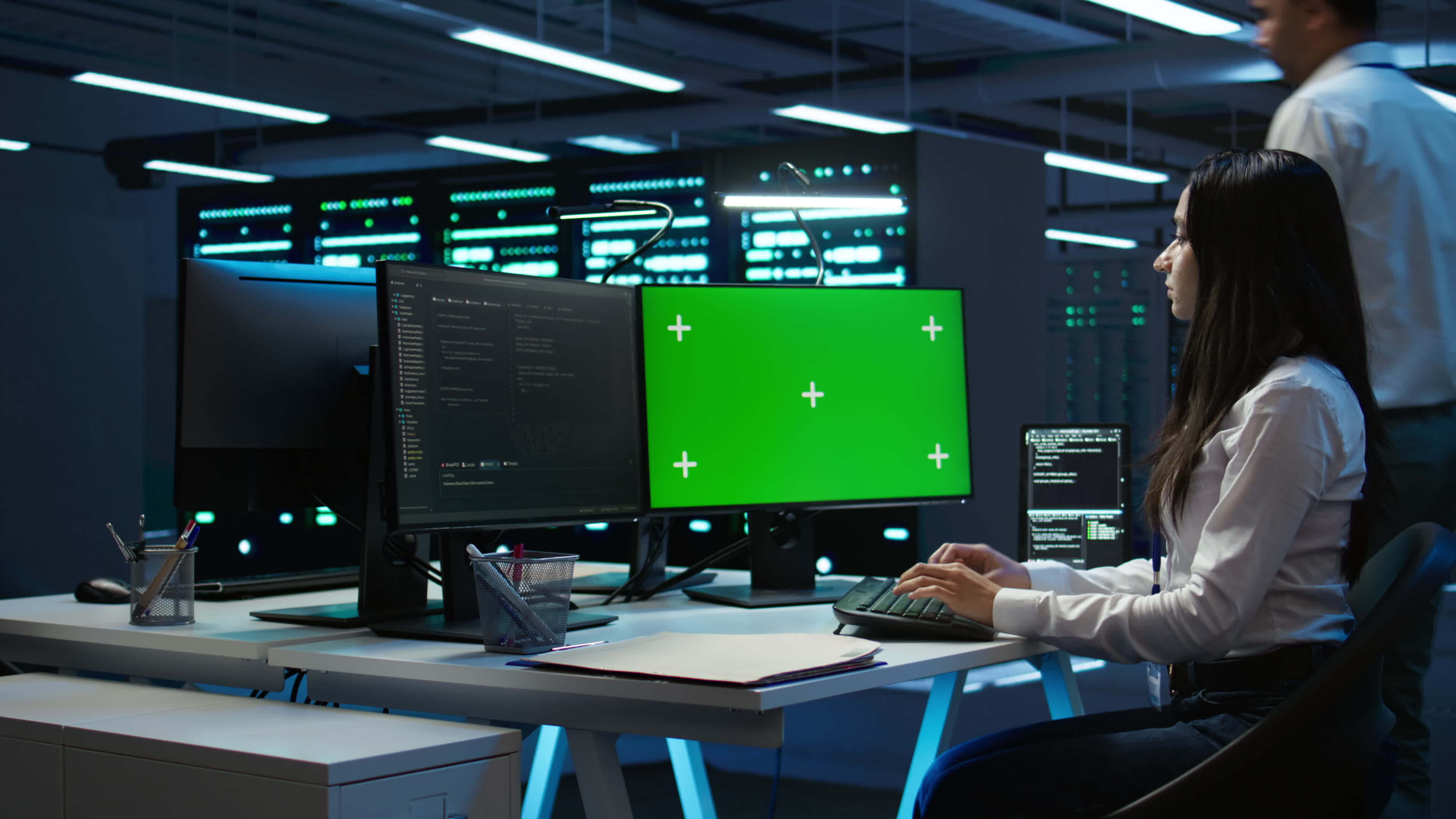 Technician Using Mockup Computer In Data Center Managing Servers