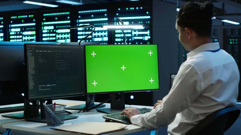 Programmer Overseeing Data Center Using Isolated Screen Computer Ensuring System Can Handle