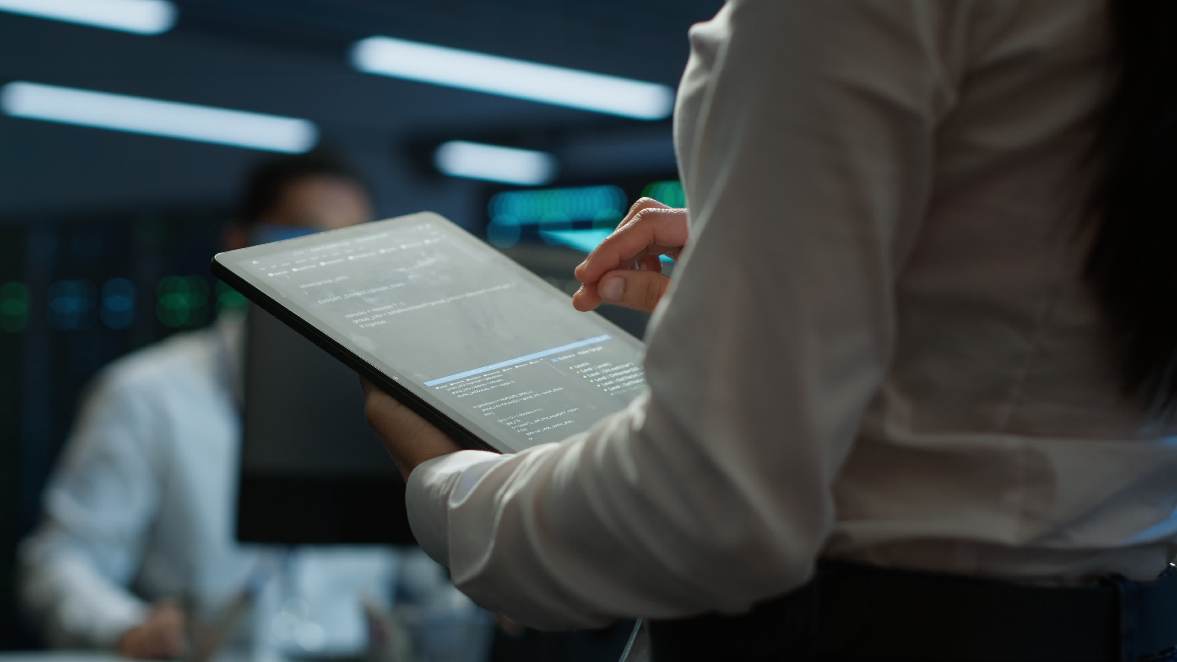 Engineer working in data center used for managing infrastructure rigs ...
