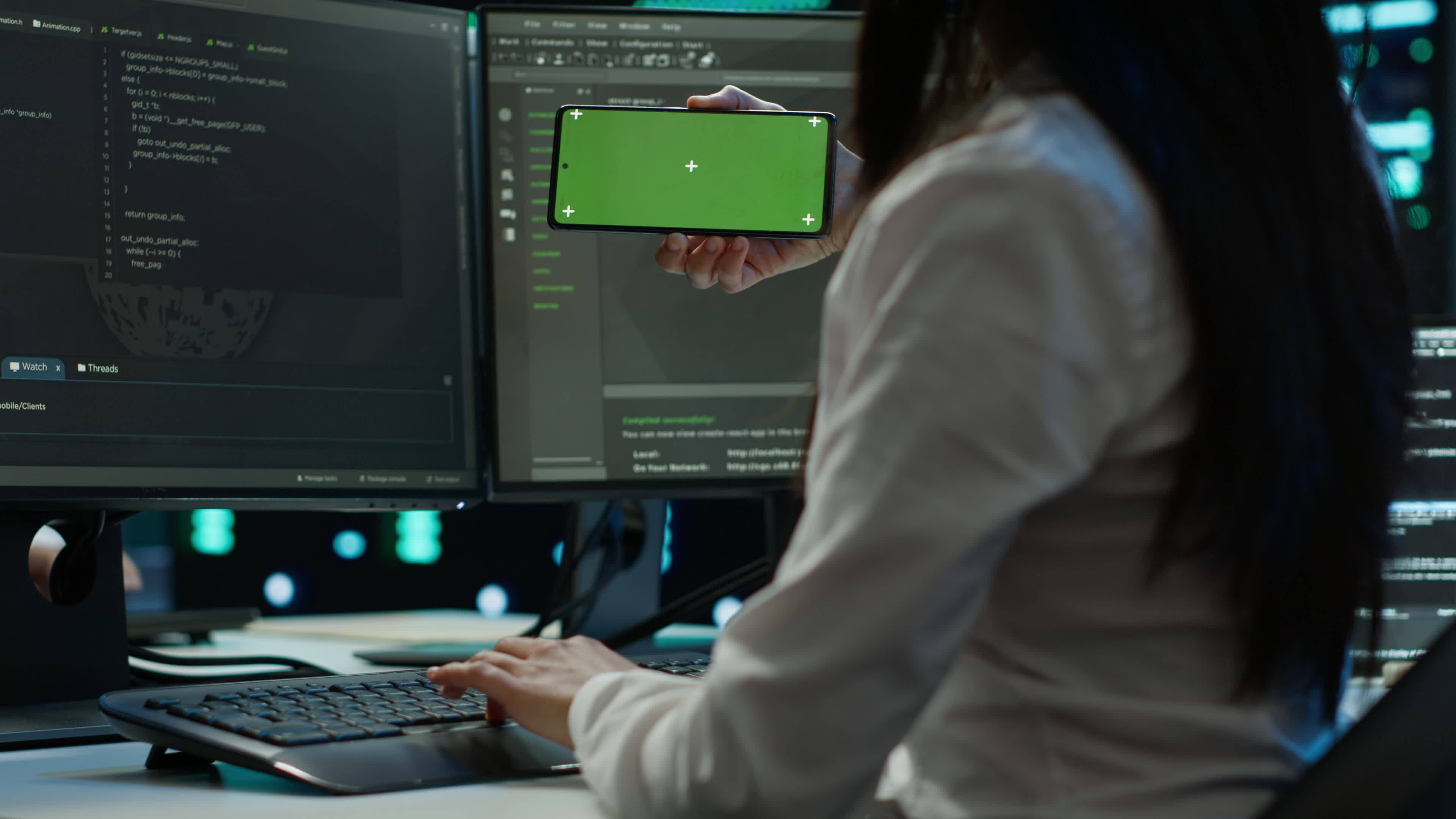 Technician Using Mockup Mobile Phone In Data Center Managing Servers