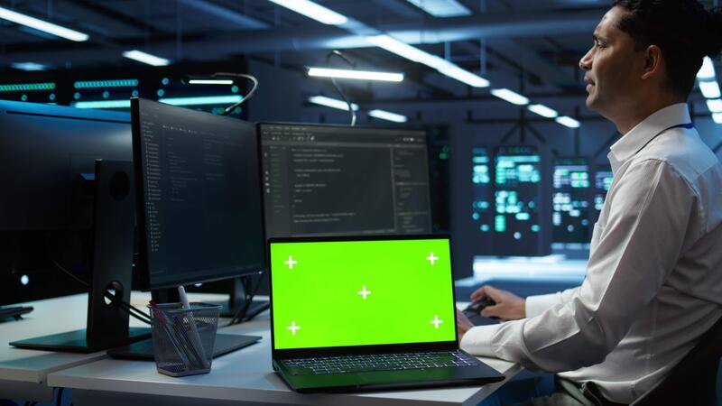 Admin In Data Center Using Isolated Screen Laptop To Design Implement And Manage Gear Ensuring