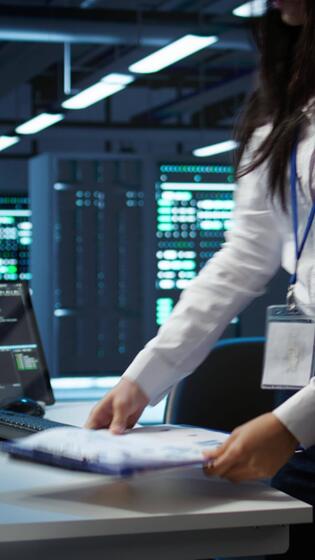 Vertical Engineer In Data Center Installing Software On Computer Helping Maintain Network
