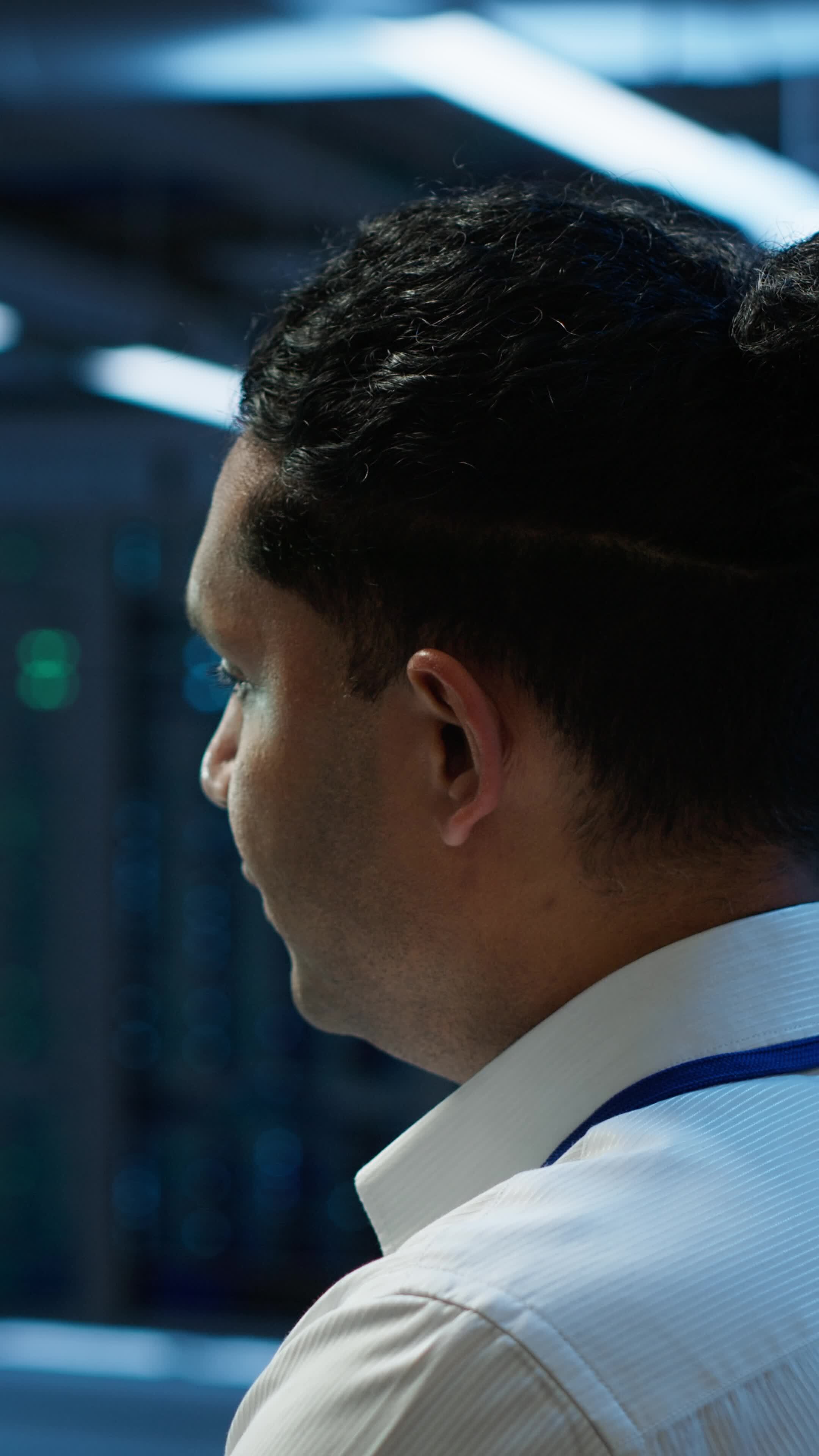 Vertical Portrait Of Smiling Technician In Data Center Implementing And Managing Infrastructure