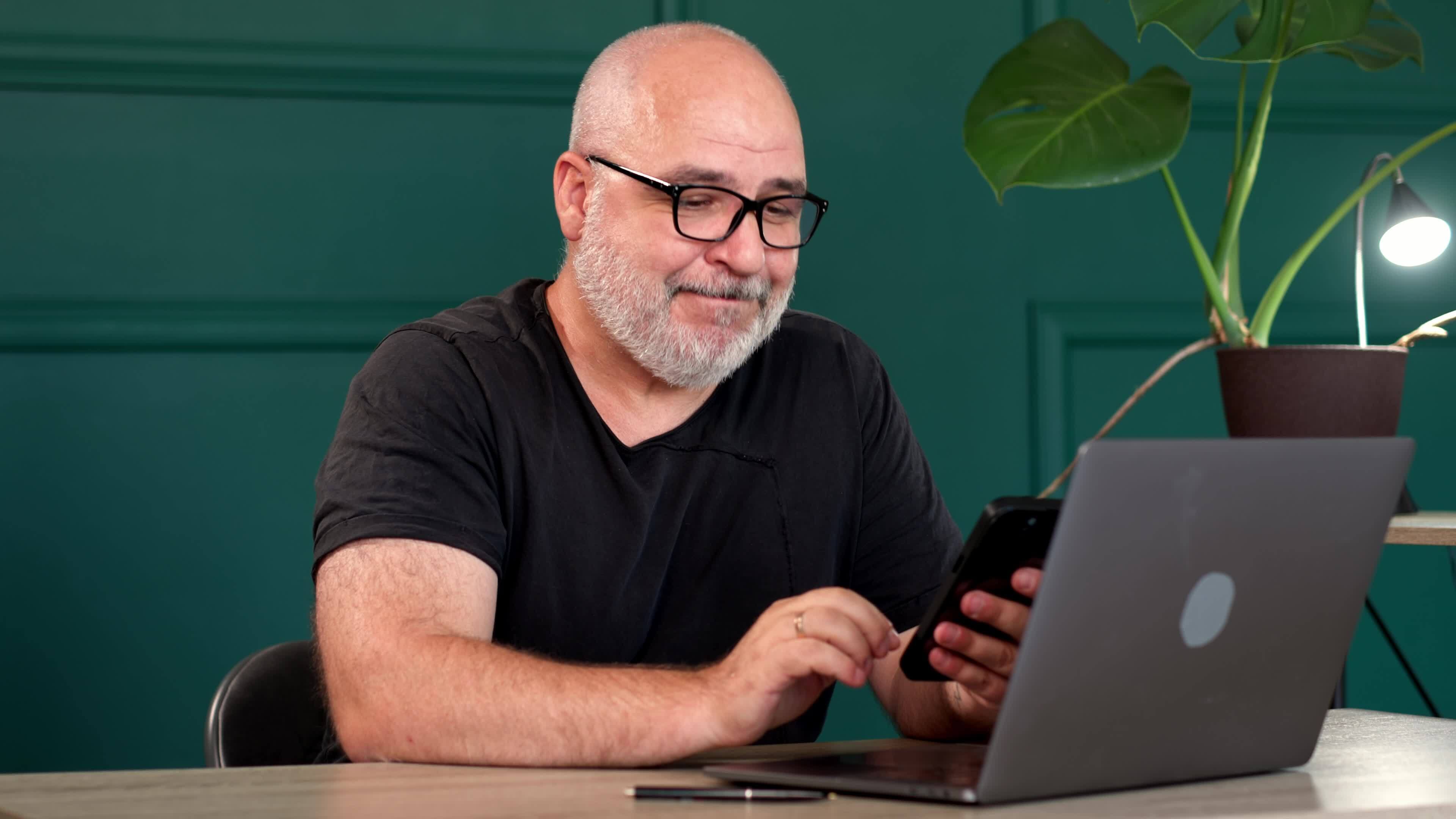 A professional male programmer brainstorms in a modern office. Perfect ... A professional male programmer brainstorms in a modern office. Perfect ...