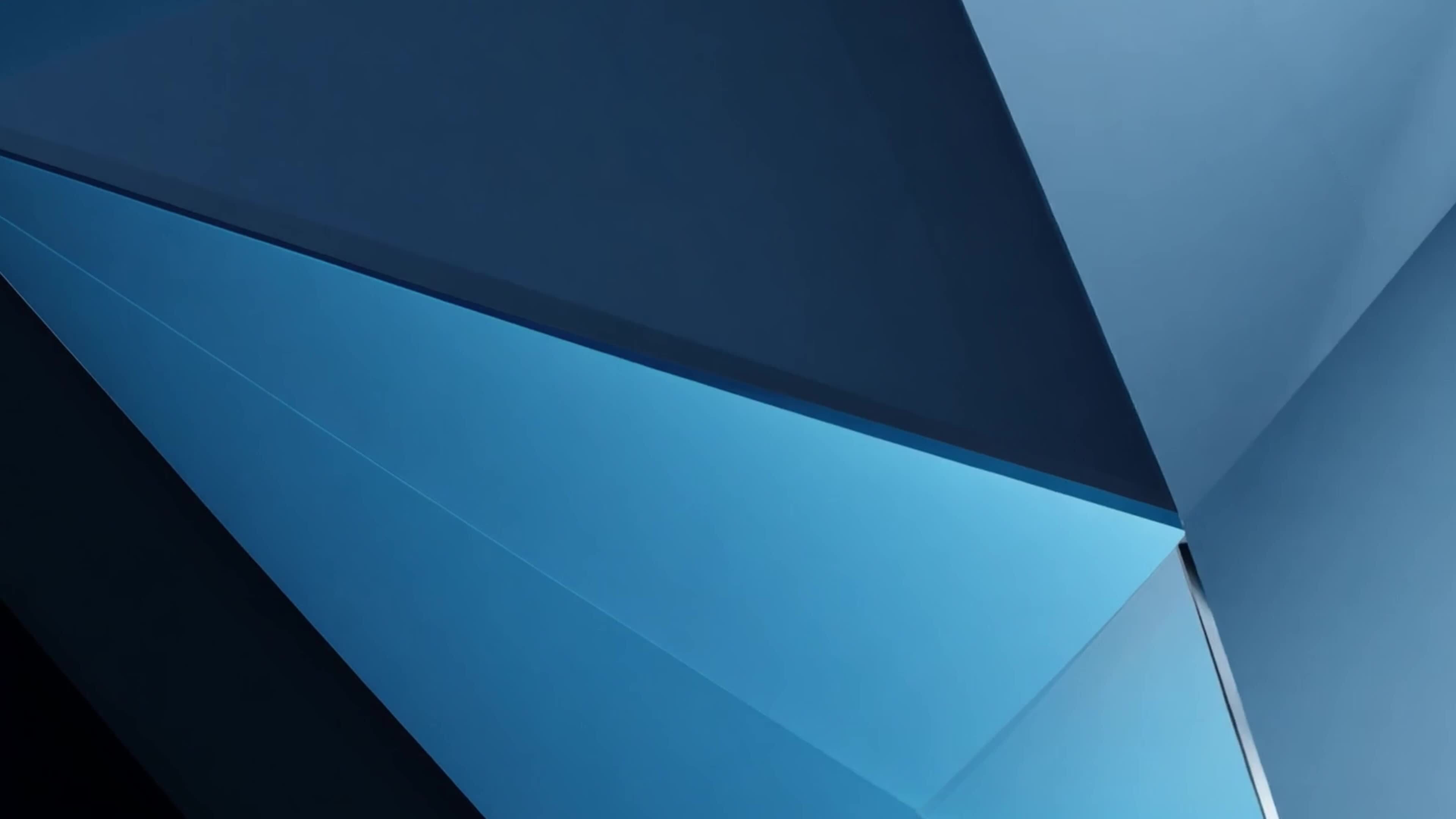 Sharp, angular shapes move in sync, forming a dynamic abstract art ...