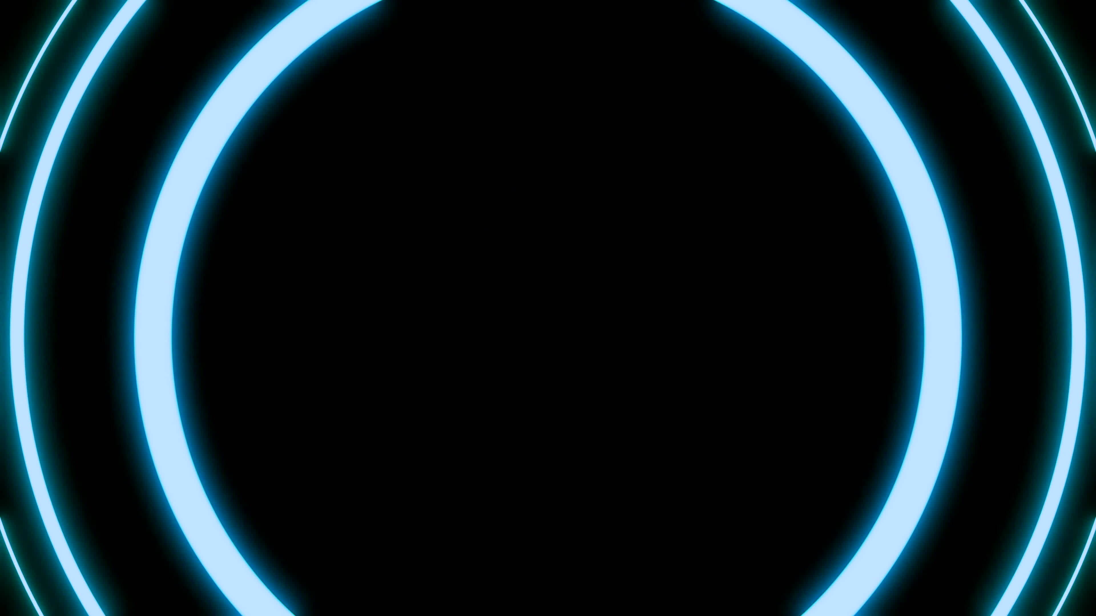 Neon circles pulsate on black background. Design. Bright rings pulsate and blink. Neon rings ...