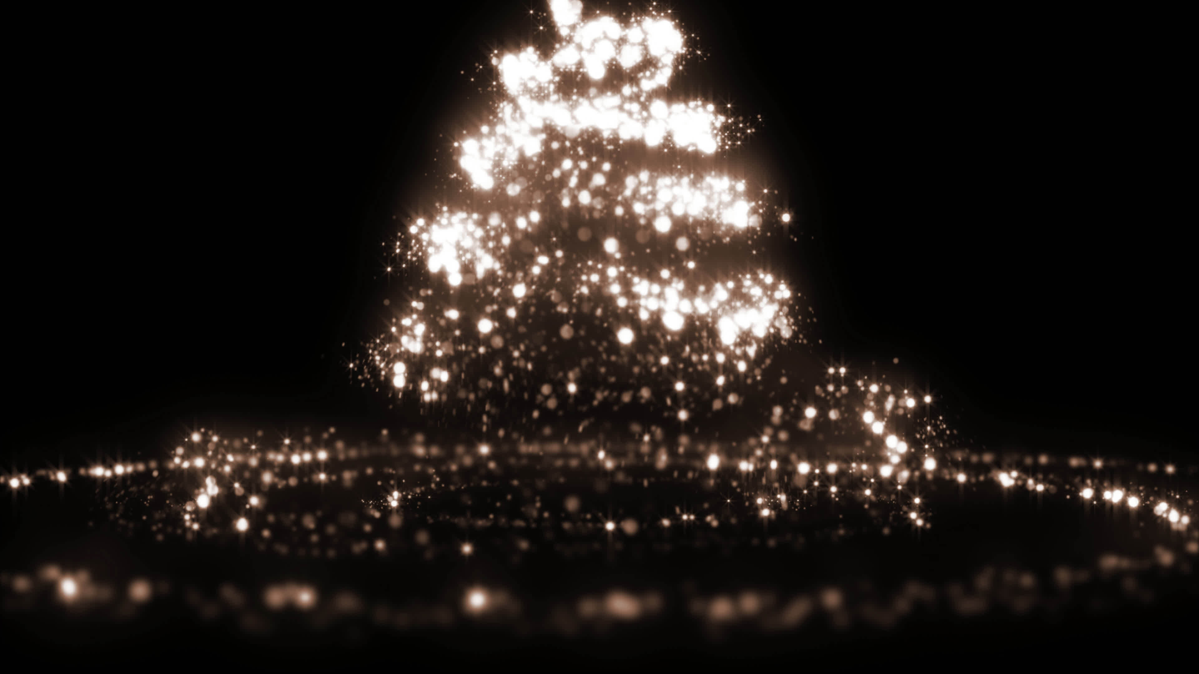 Glowing trail forming Christmas tree animation with light and particles with black background ...