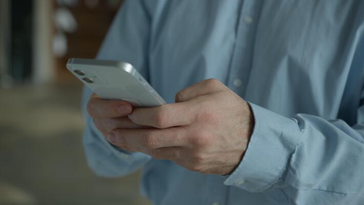 Person Scrolling On Phone Stock Video Footage for Free Download