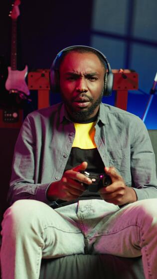 Vertical Annoyed Man Shouting After Losing While Playing Online