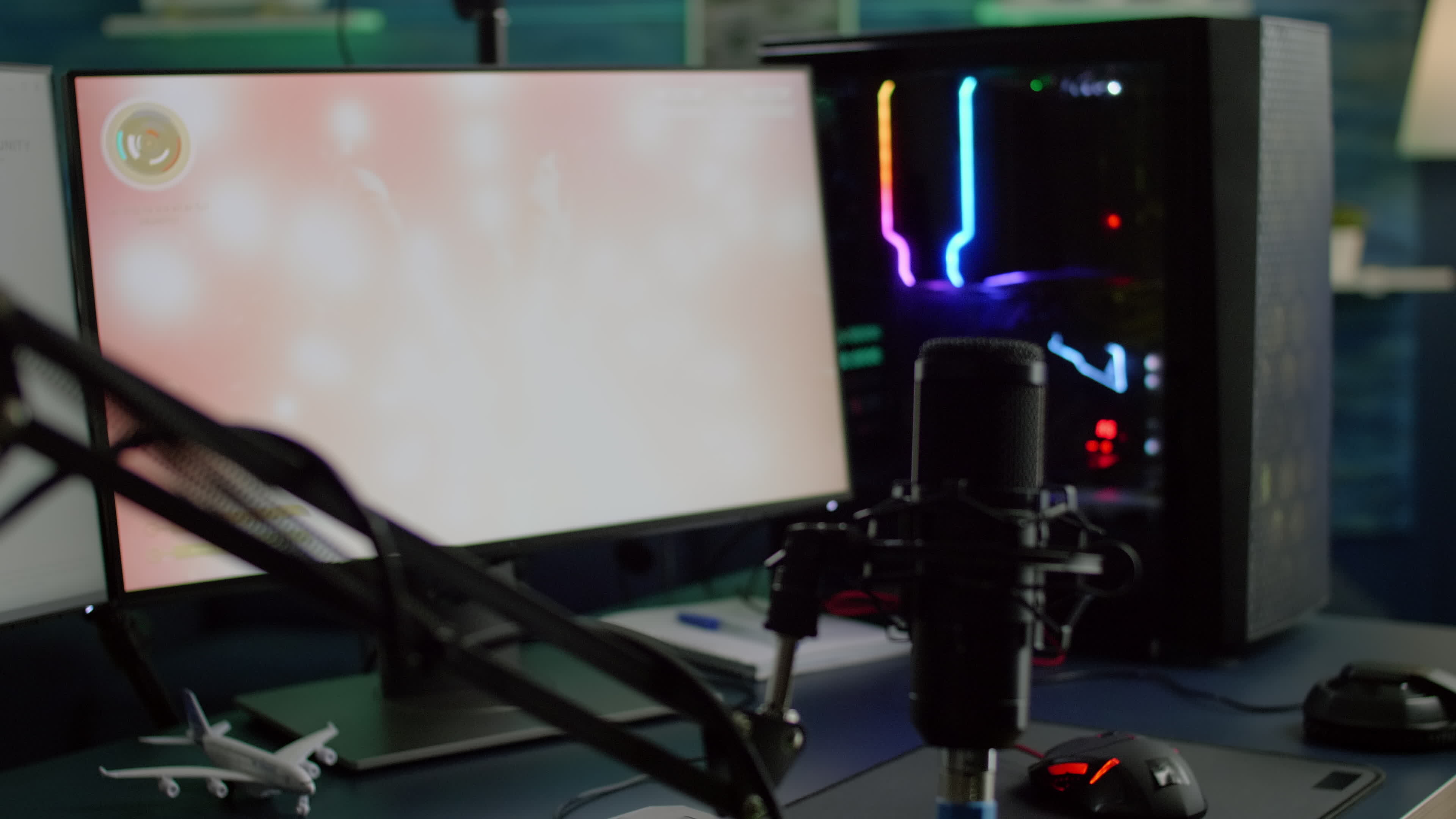 Game is loading on display of RGB professional powerful computer and stream chat is prepared for ...