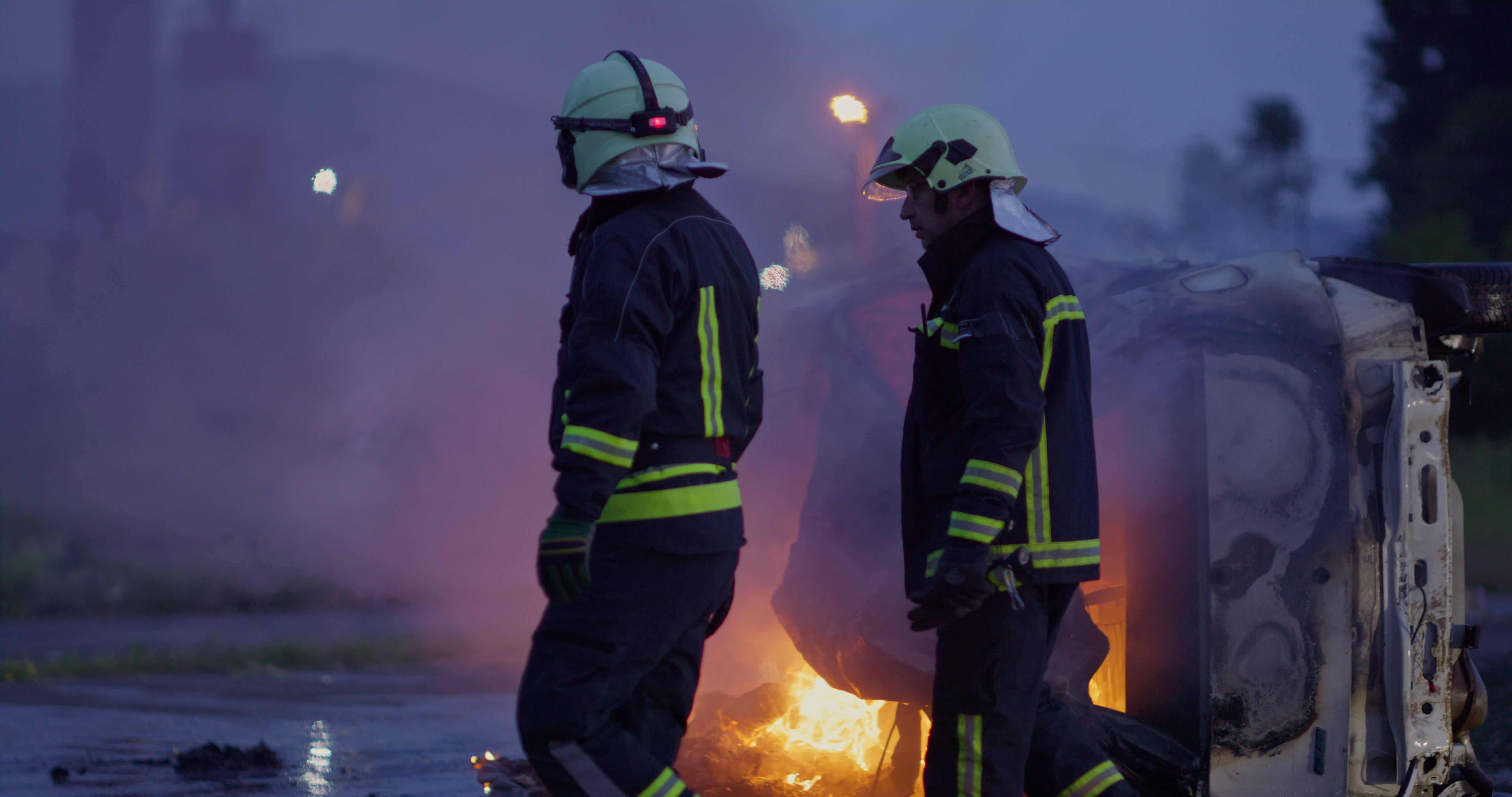 Firefighters fight the fire flame to control fire not to spreading out ...
