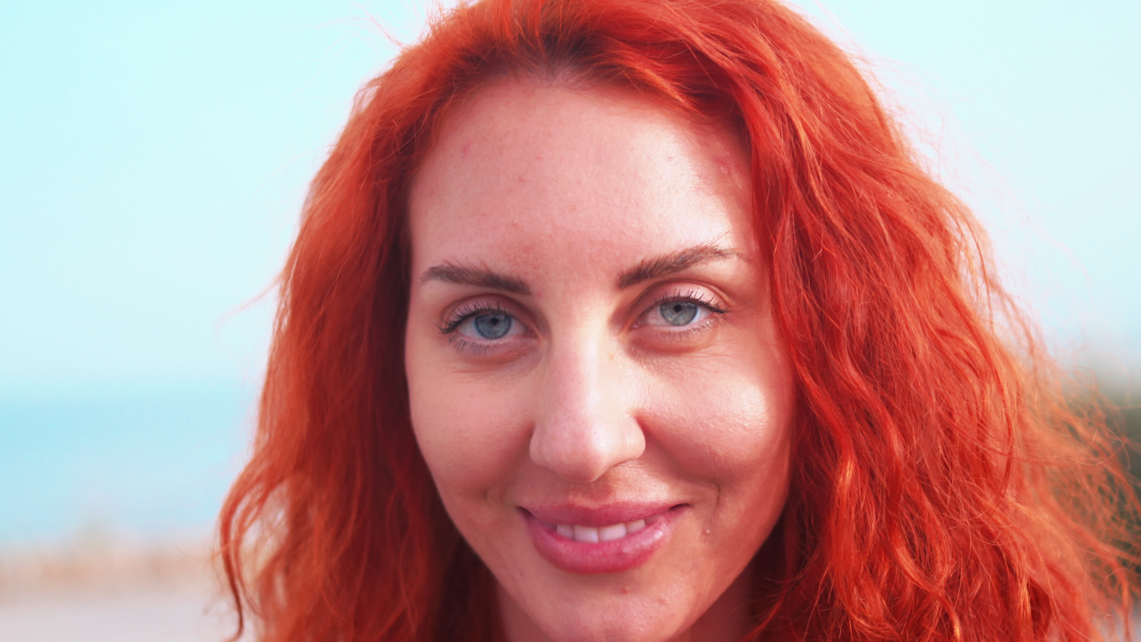 Happy Redheaded Sporty Woman Smiling Against Blue Sky During Sunny Day 49625499 Stock Video At