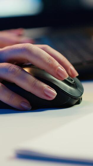 Vertical Extreme Close Up Shot Of Editor Selecting Key Frames To Use While Doing Montage